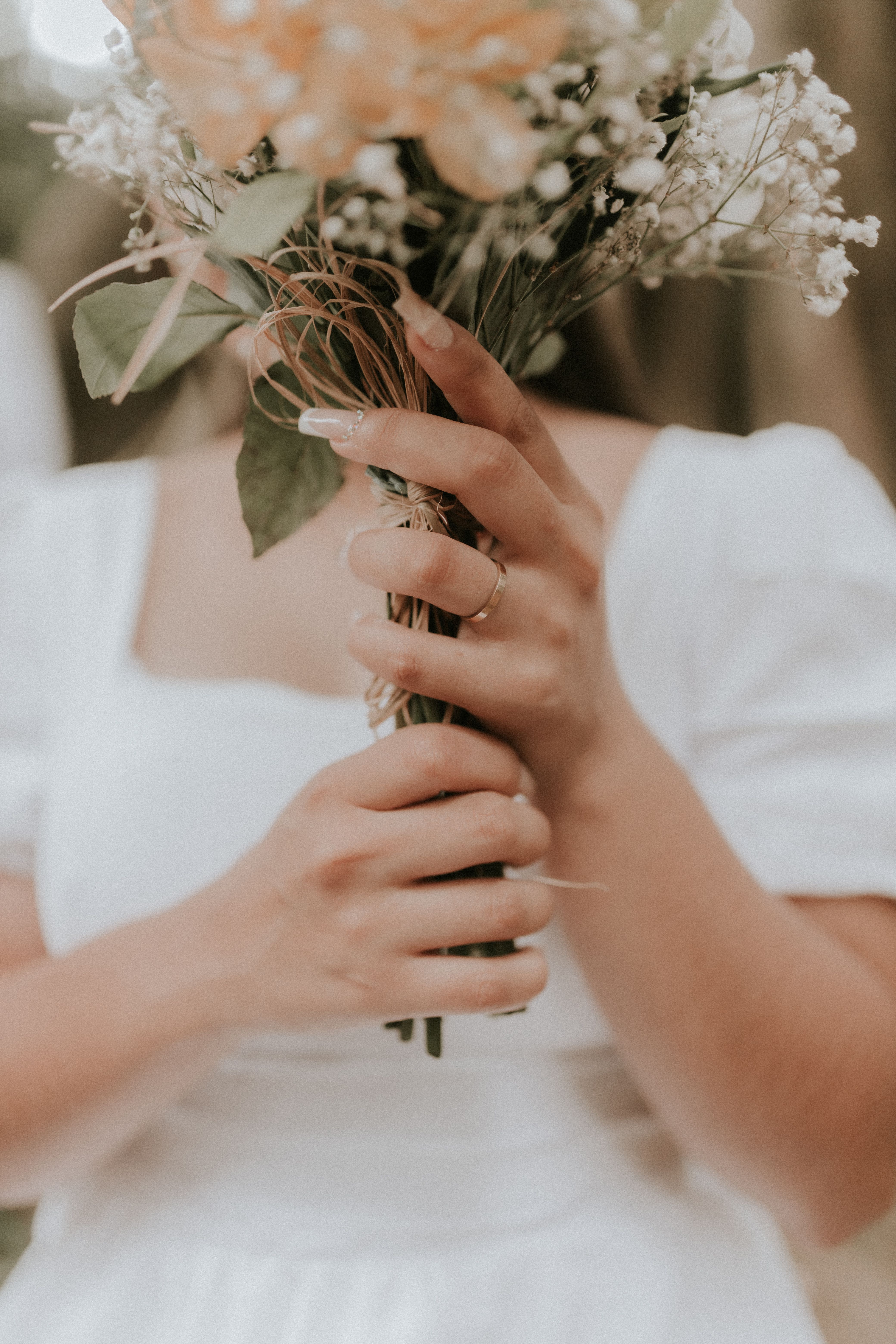 Bride Holding Flower Bouquet · Free Stock Photo