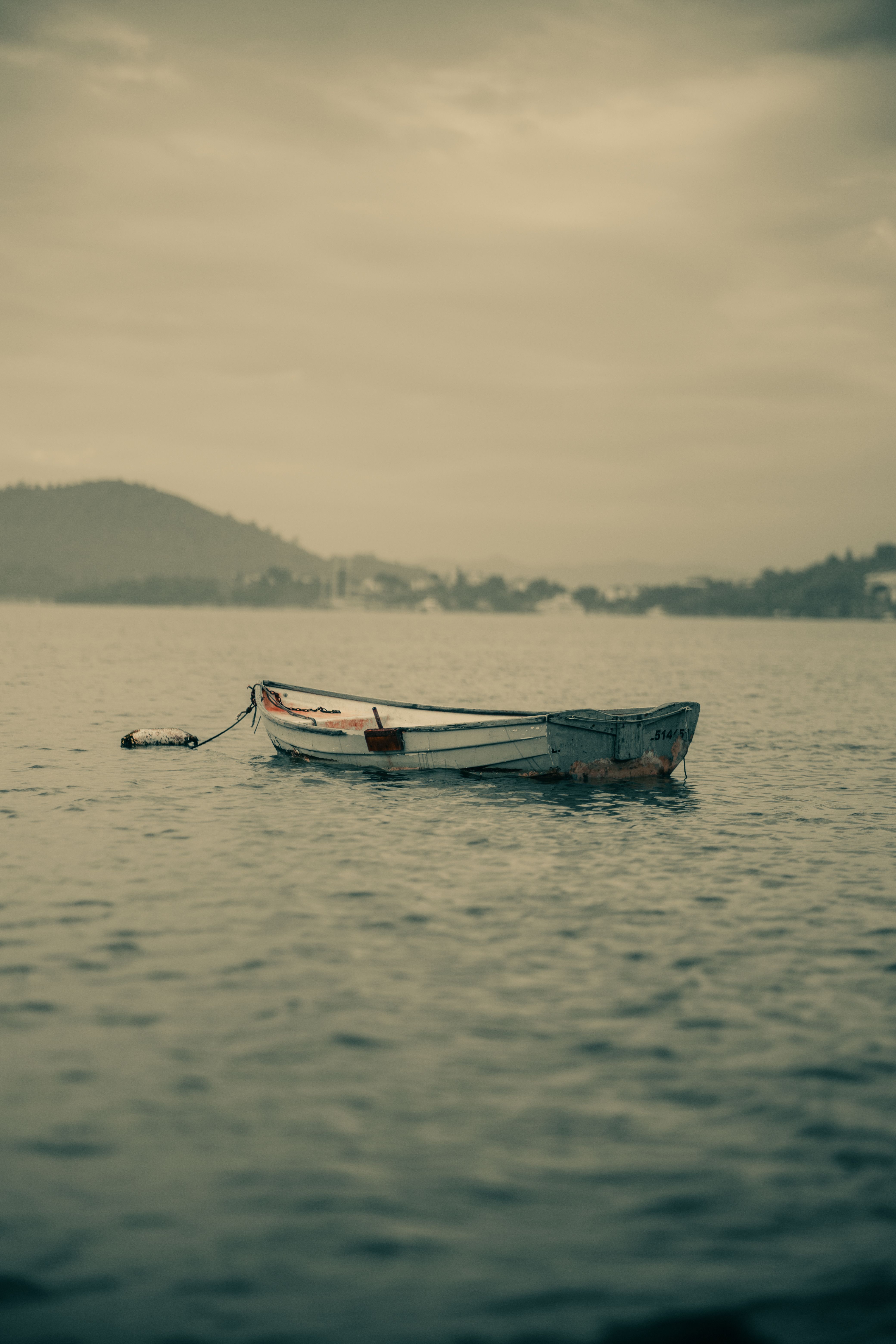 Empty Boat Floating near the Coast · Free Stock Photo