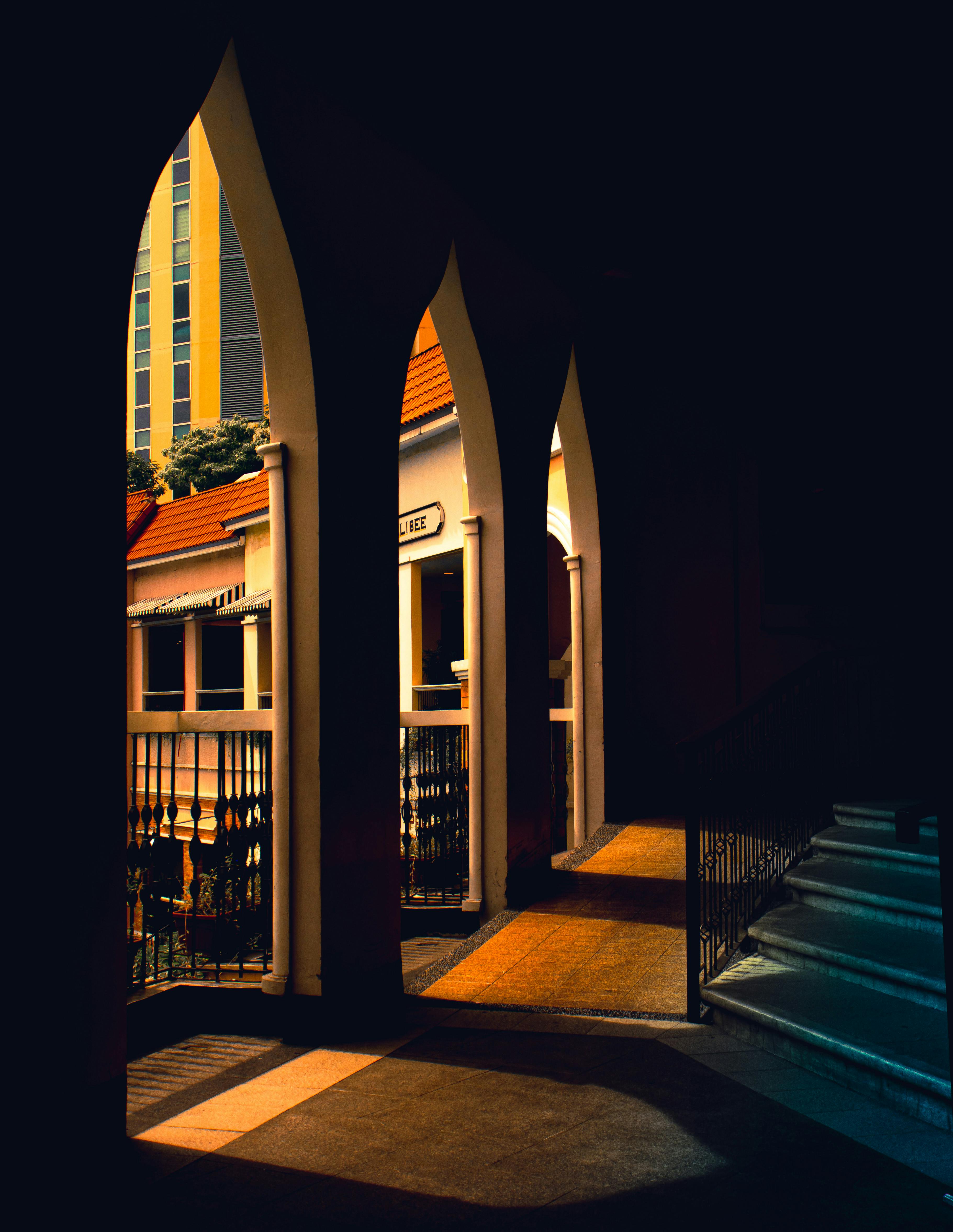 Arches and Shadows behind · Free Stock Photo