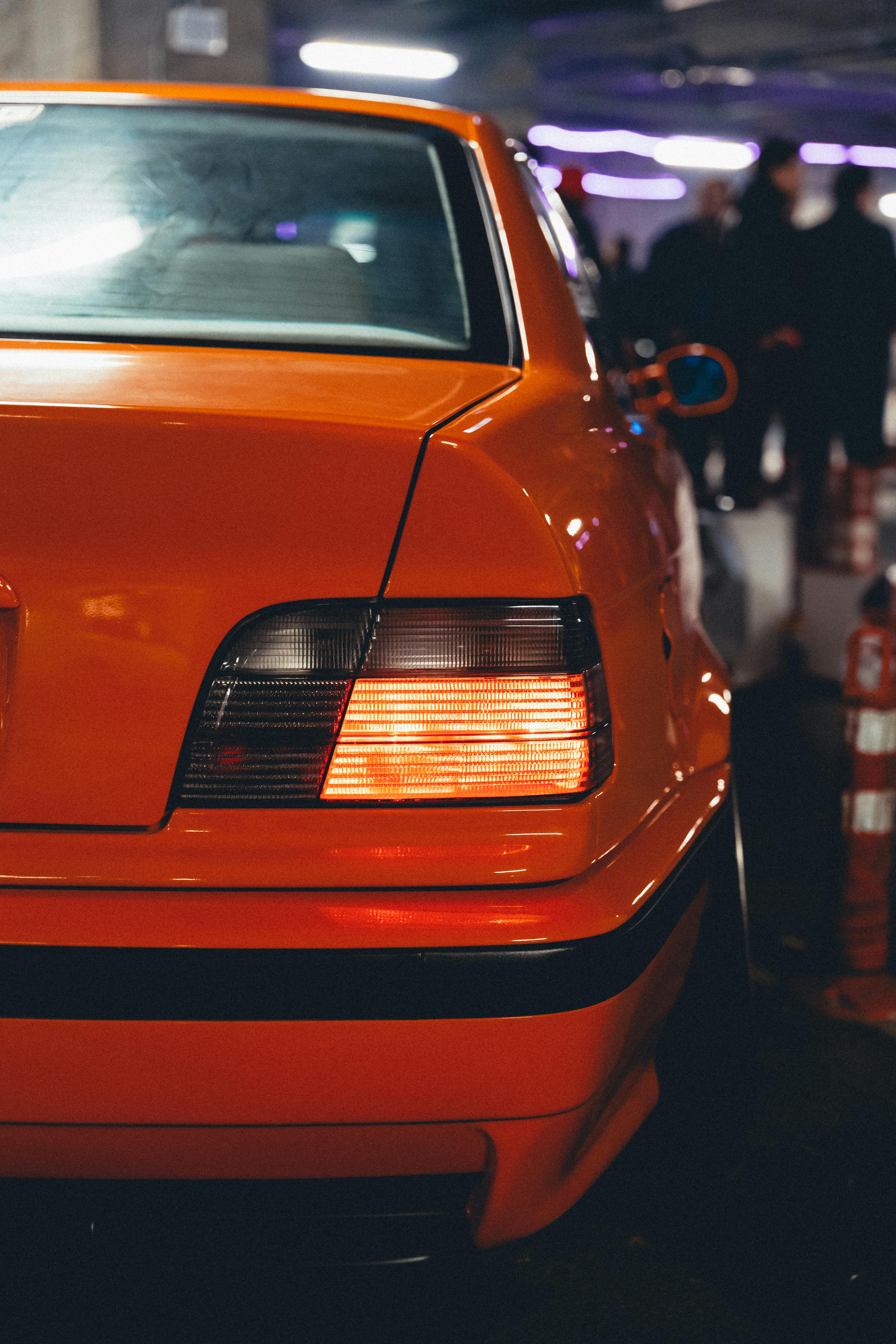 Back of a Red BMW E36 on a Parking Lot · Free Stock Photo