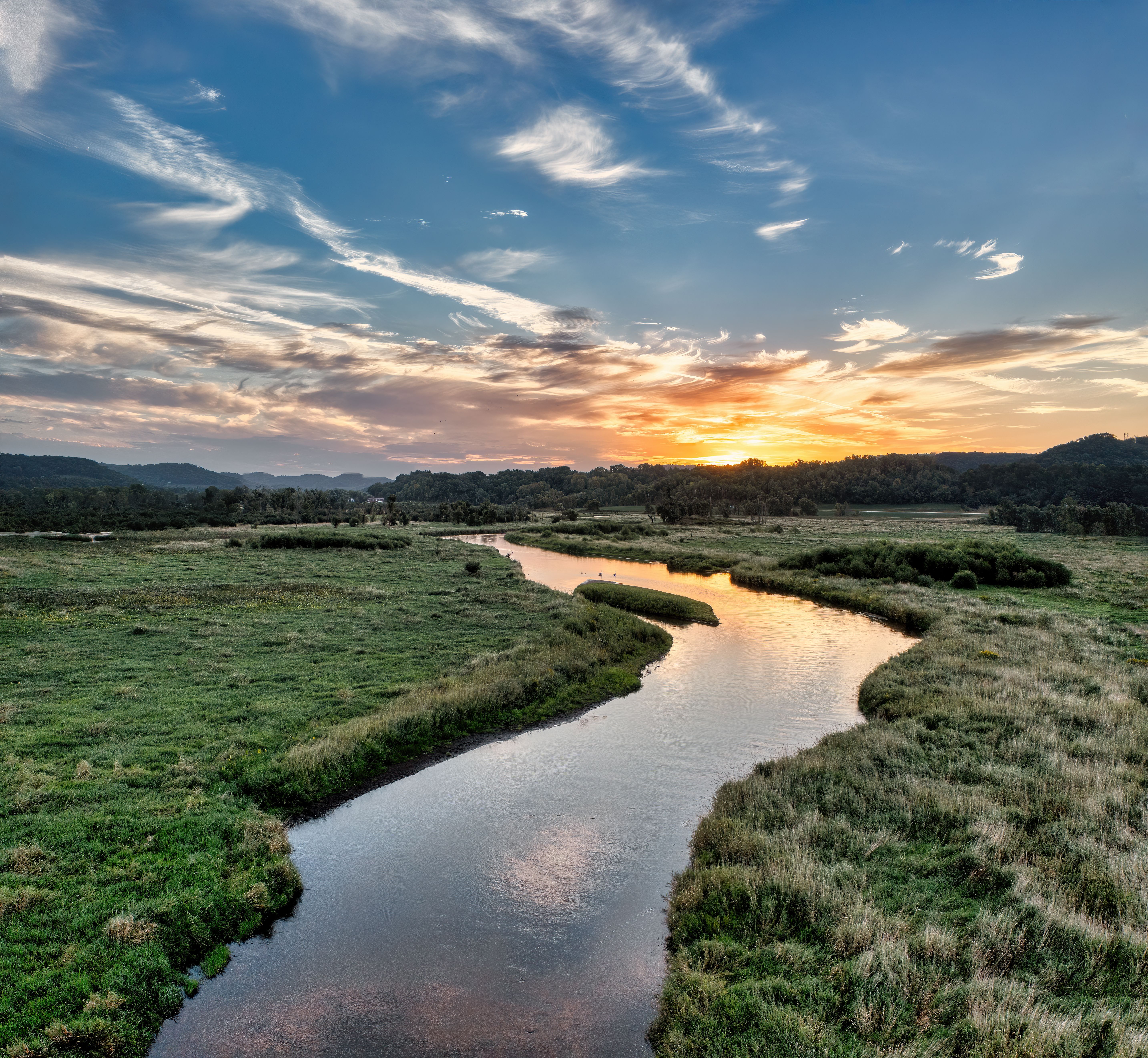 View of a River and Grass Fields at Sunset · Free Stock Photo