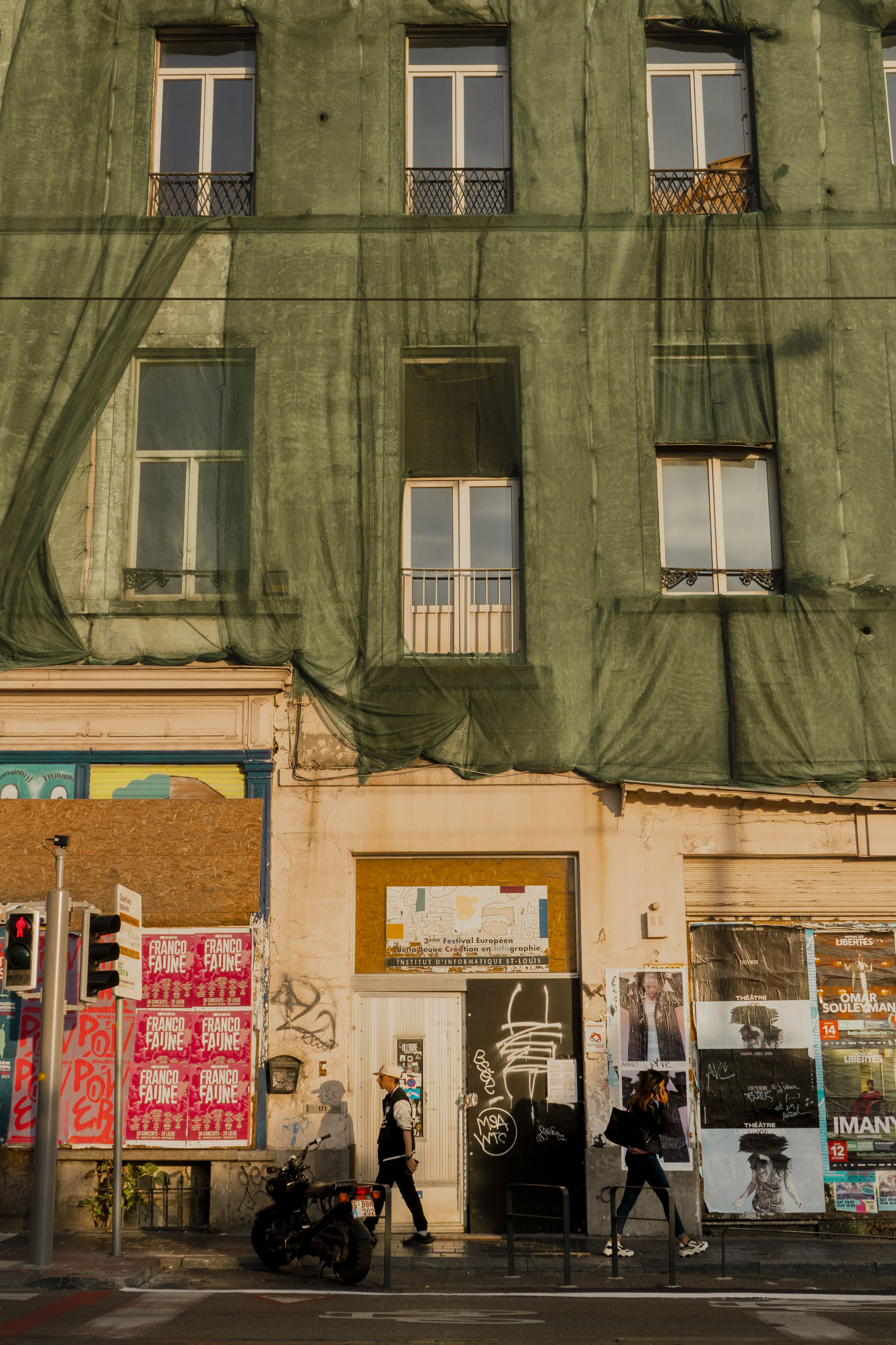 Tenement House Covered with Green Cloth · Free Stock Photo