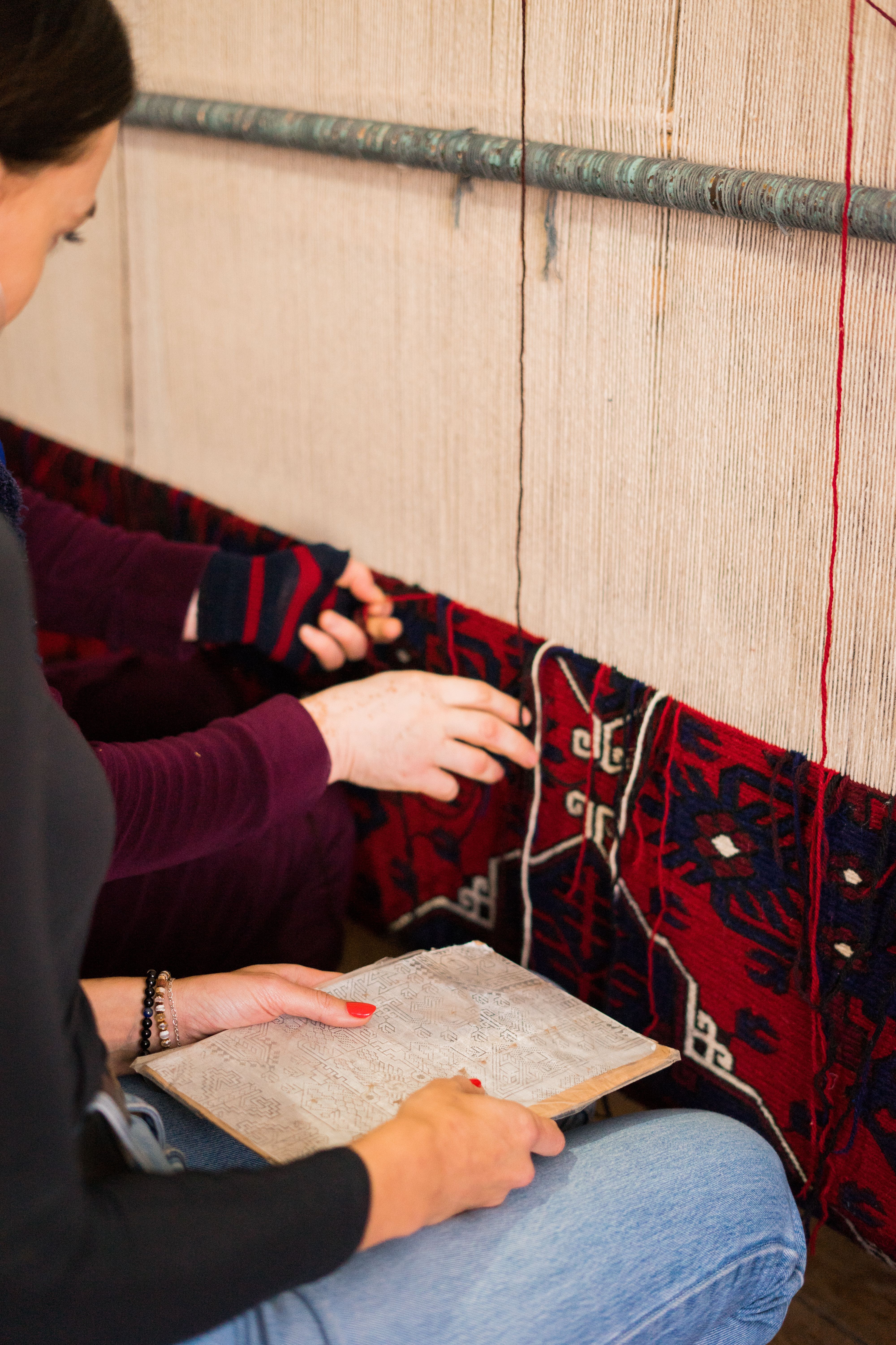 Woman Sitting and Sewing Carpet · Free Stock Photo