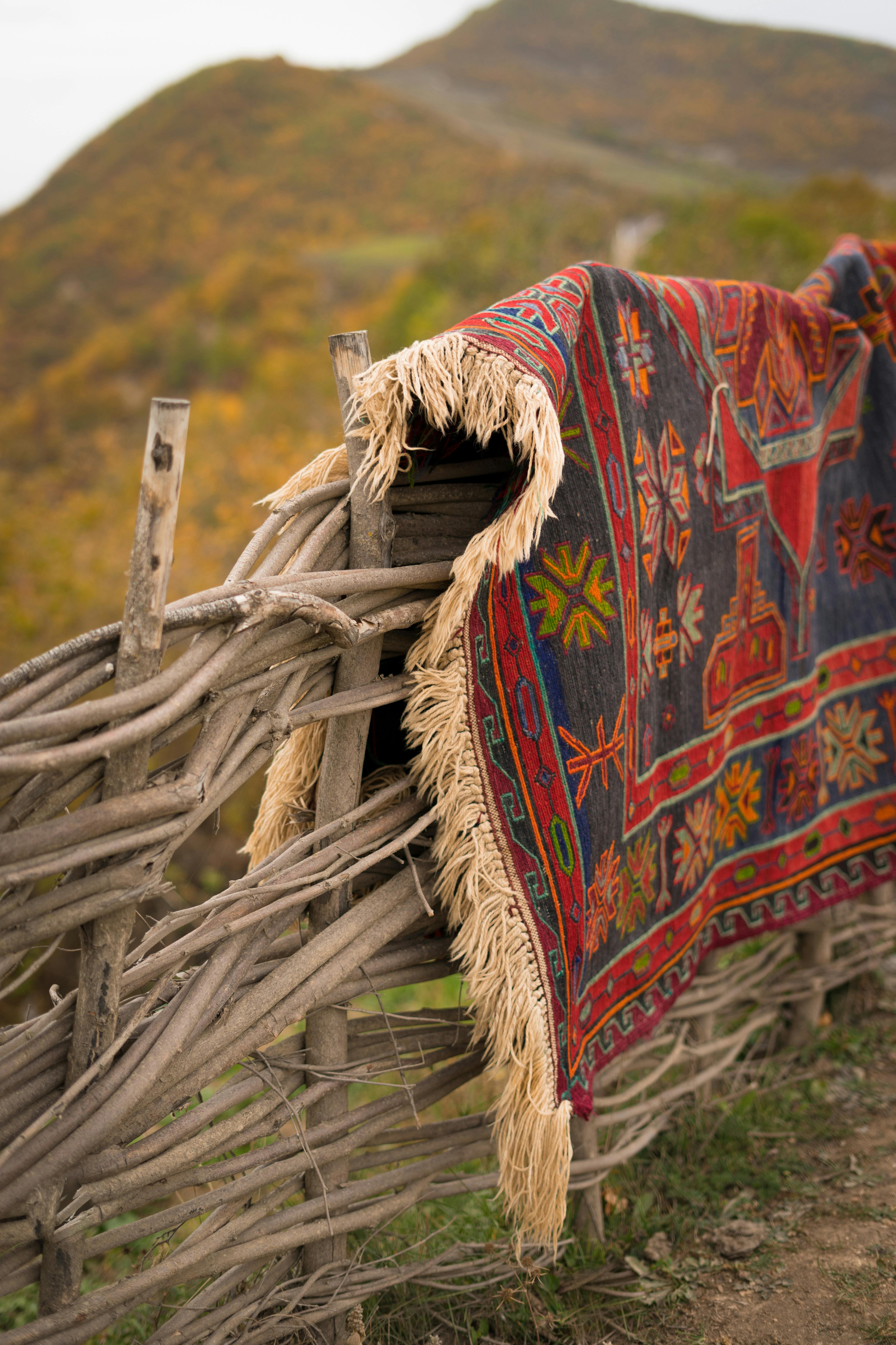 Handmade Carpet on Wooden Fence · Free Stock Photo