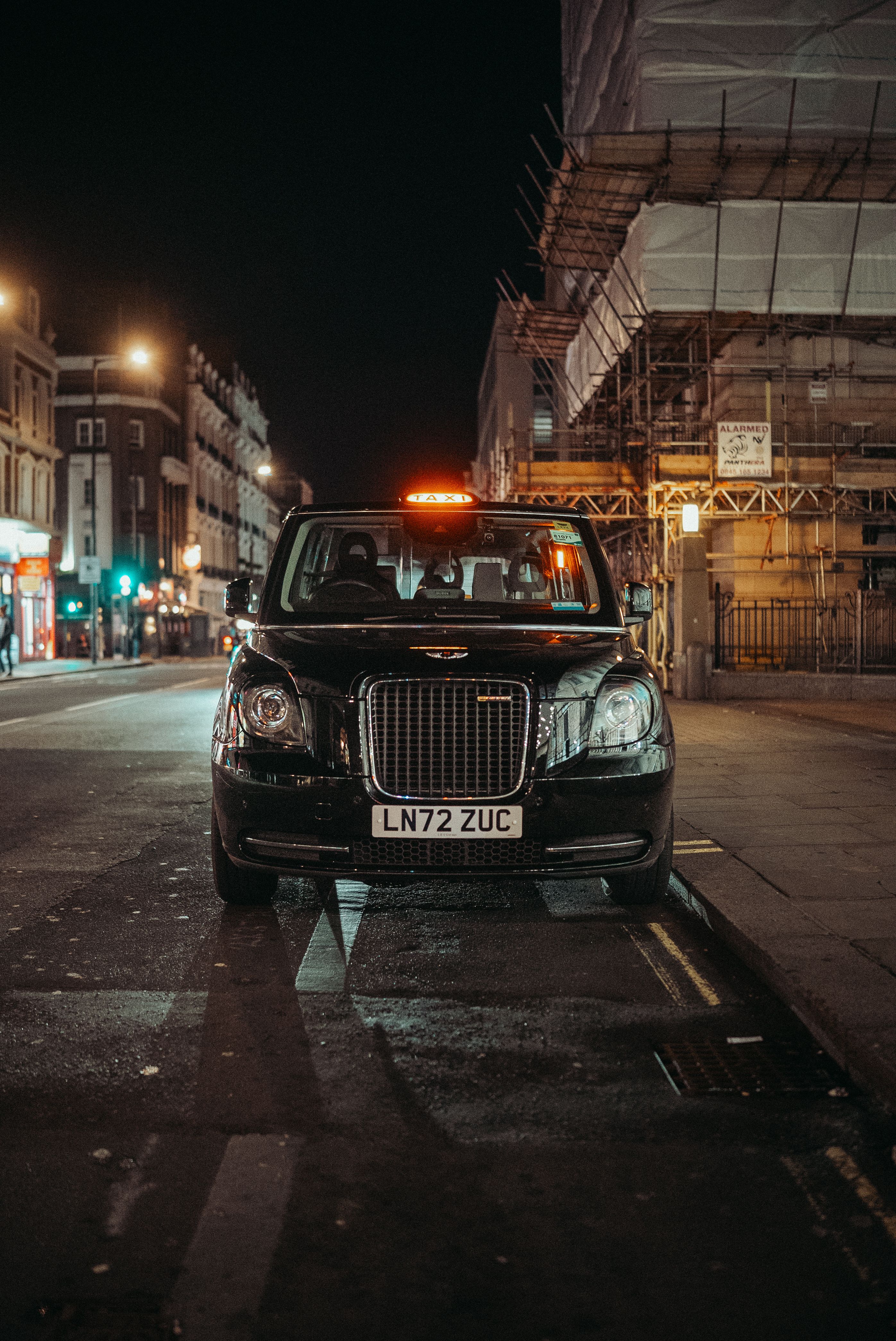 Taxi Parked on City Street at Night · Free Stock Photo