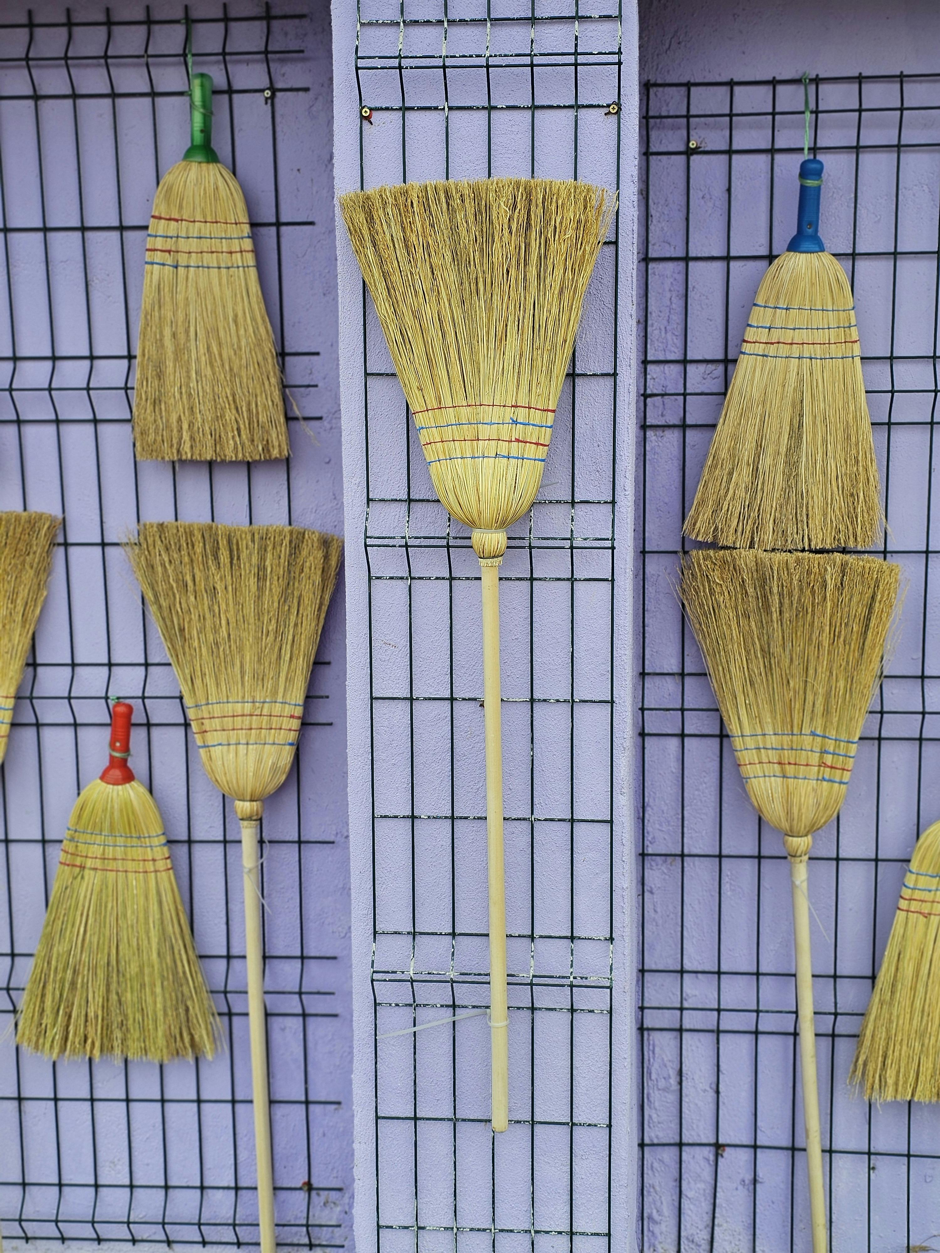 Brooms Hanging on Wall · Free Stock Photo