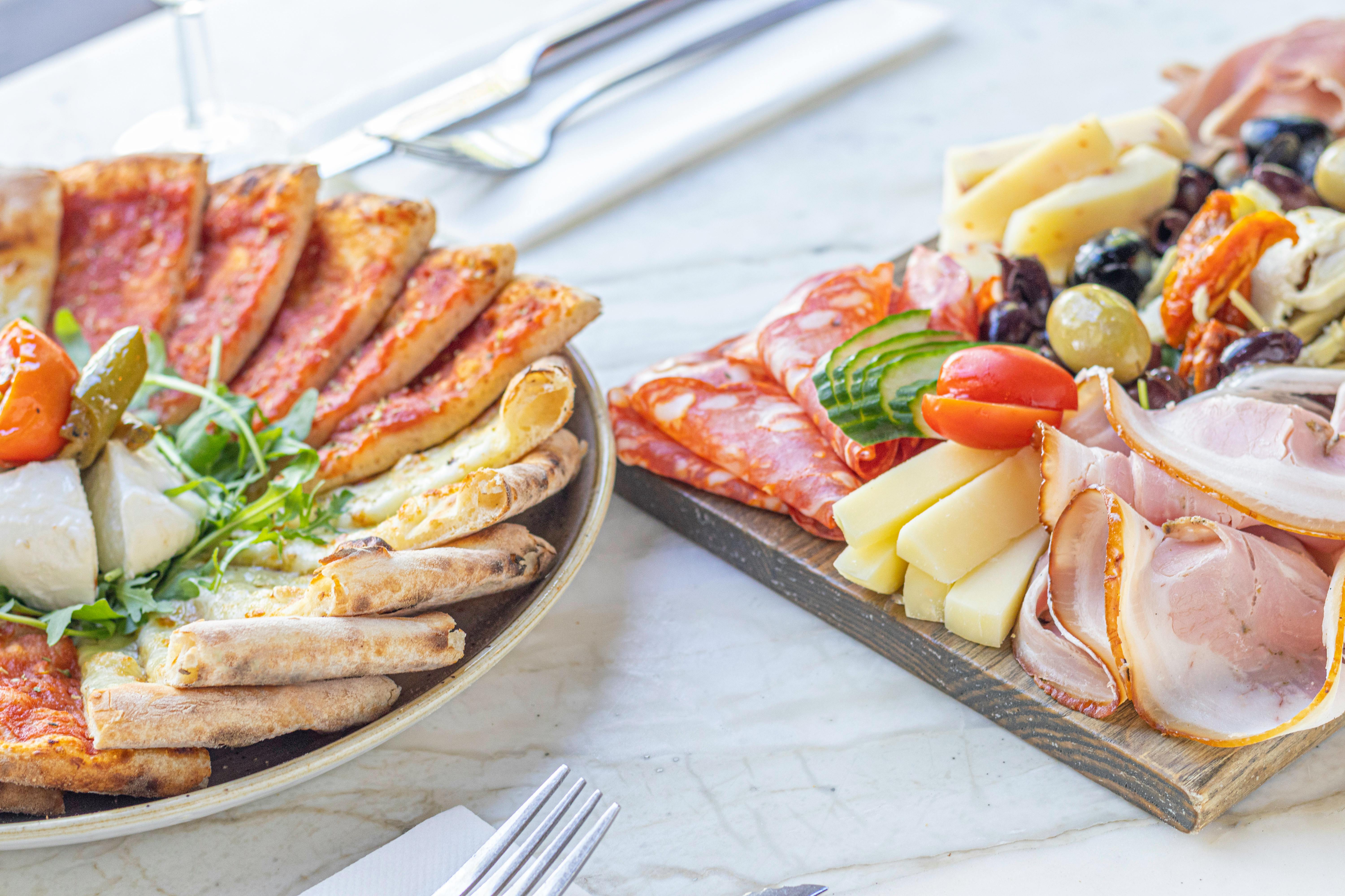 Party Catering with Pizza Slices and Snacls · Free Stock Photo