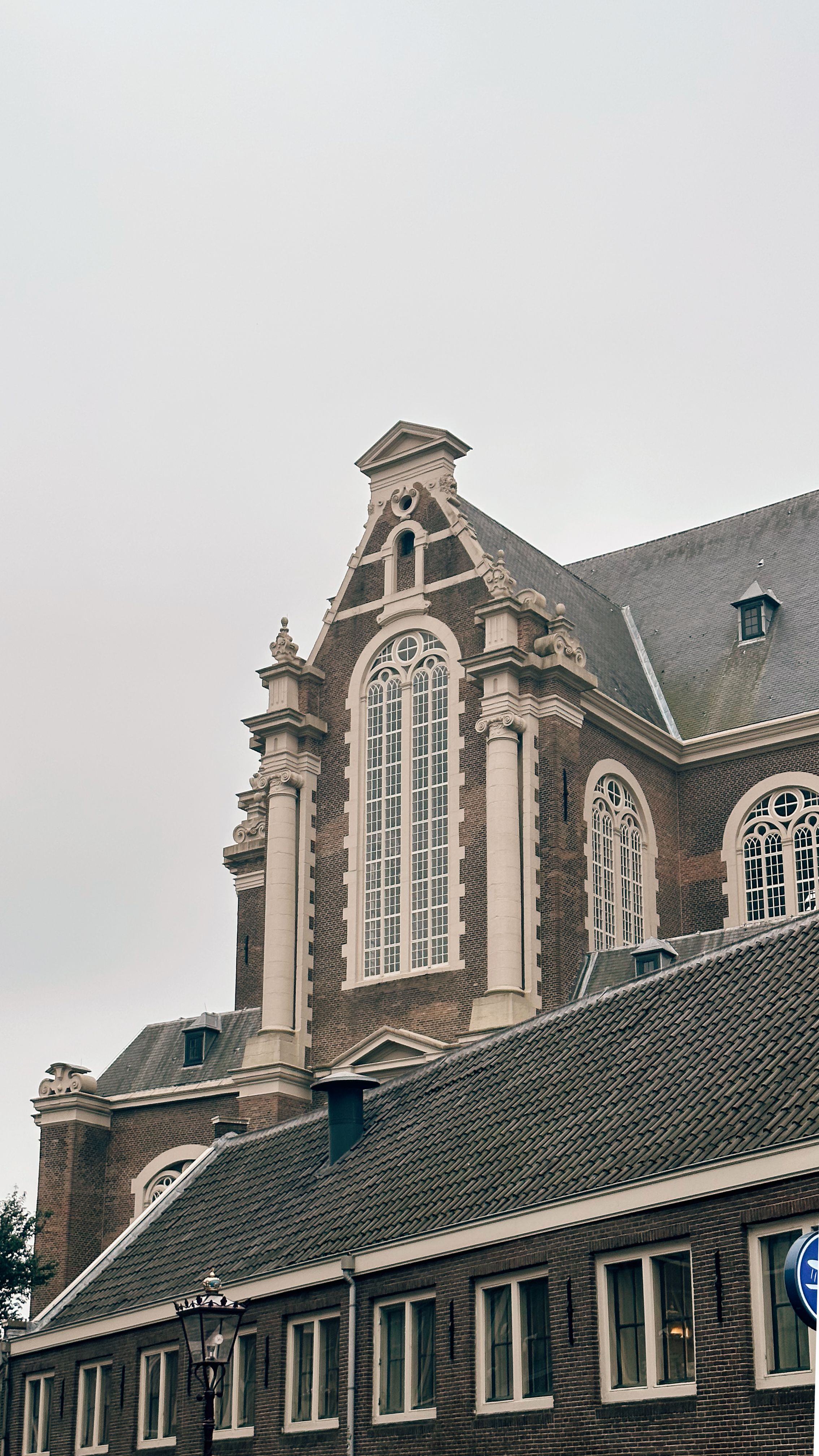 Exterior facade of the Westerkerk church in Amsterdam on an overcast day