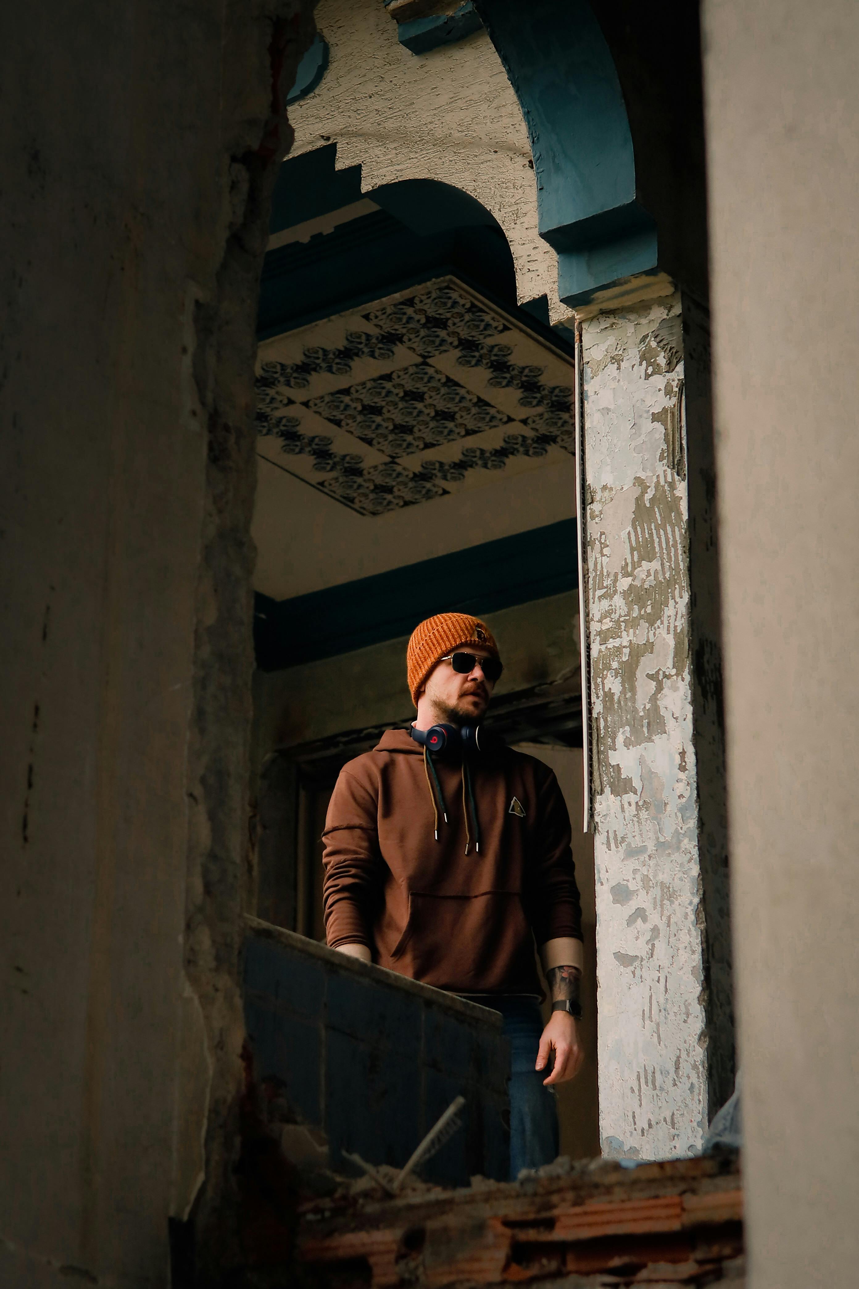 Man Standing Under an Antique Arch · Free Stock Photo