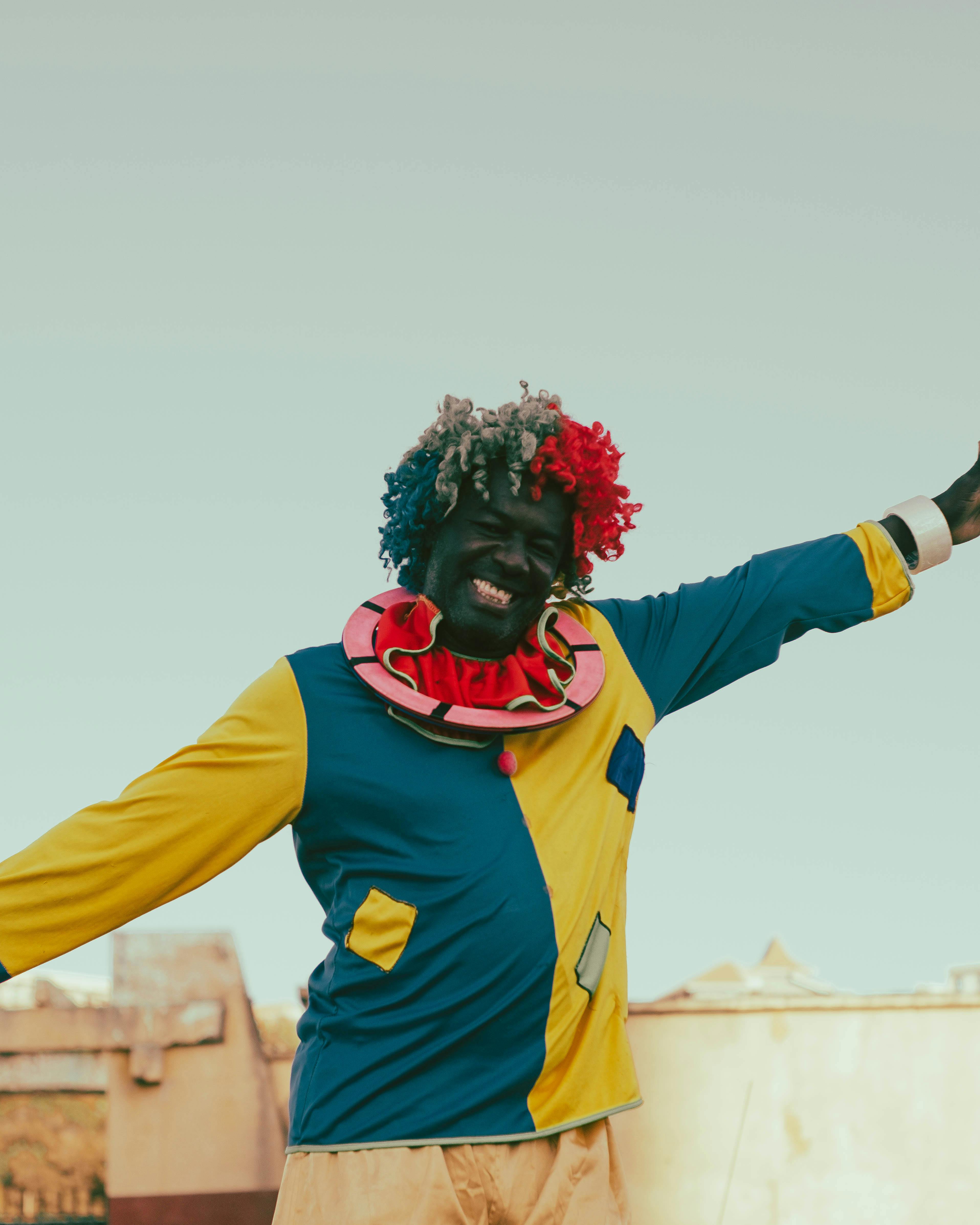 Funny clown with makeup and costume on street with umbrella · Free ...