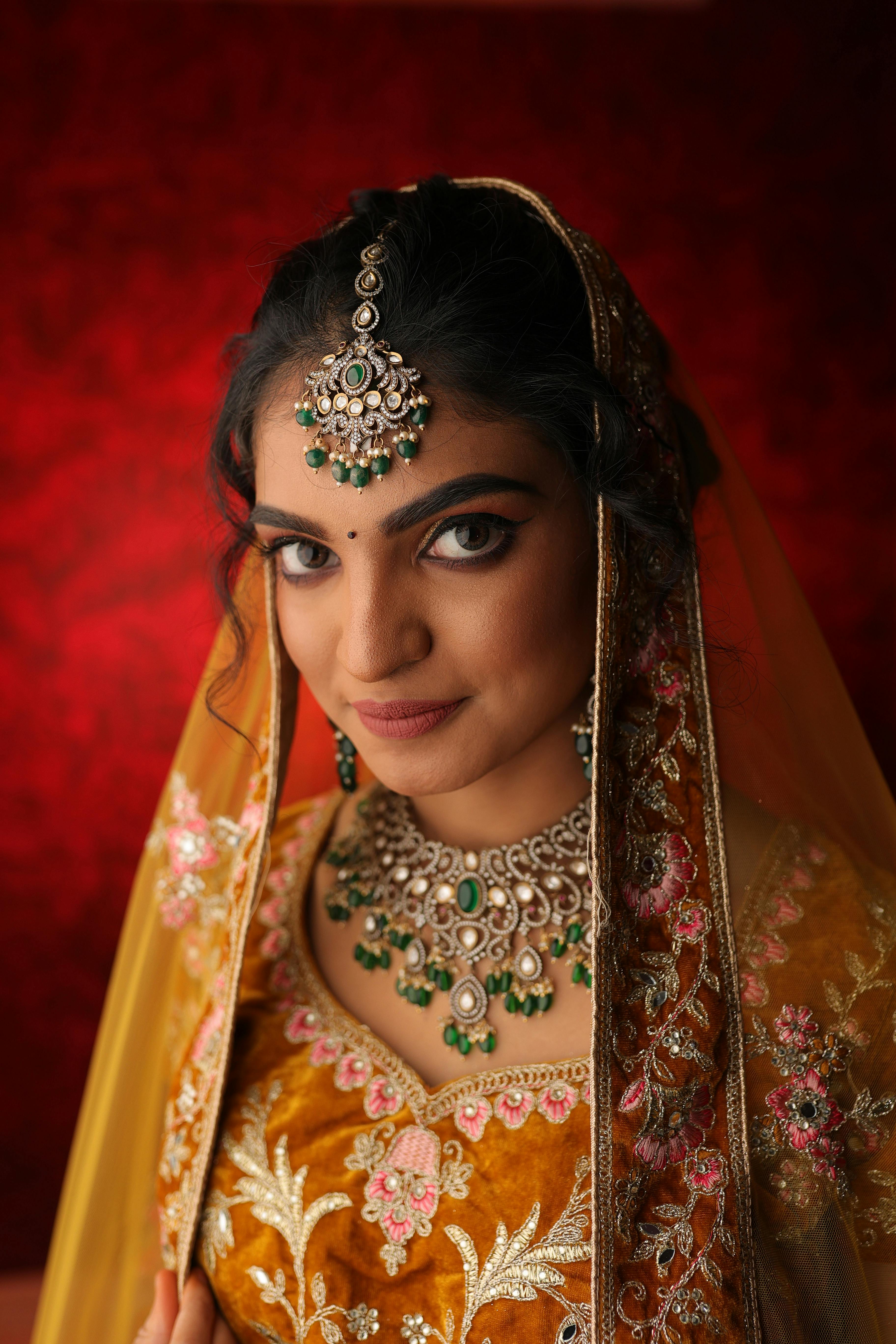 Woman Sitting in Yellow, Traditional Clothing · Free Stock Photo