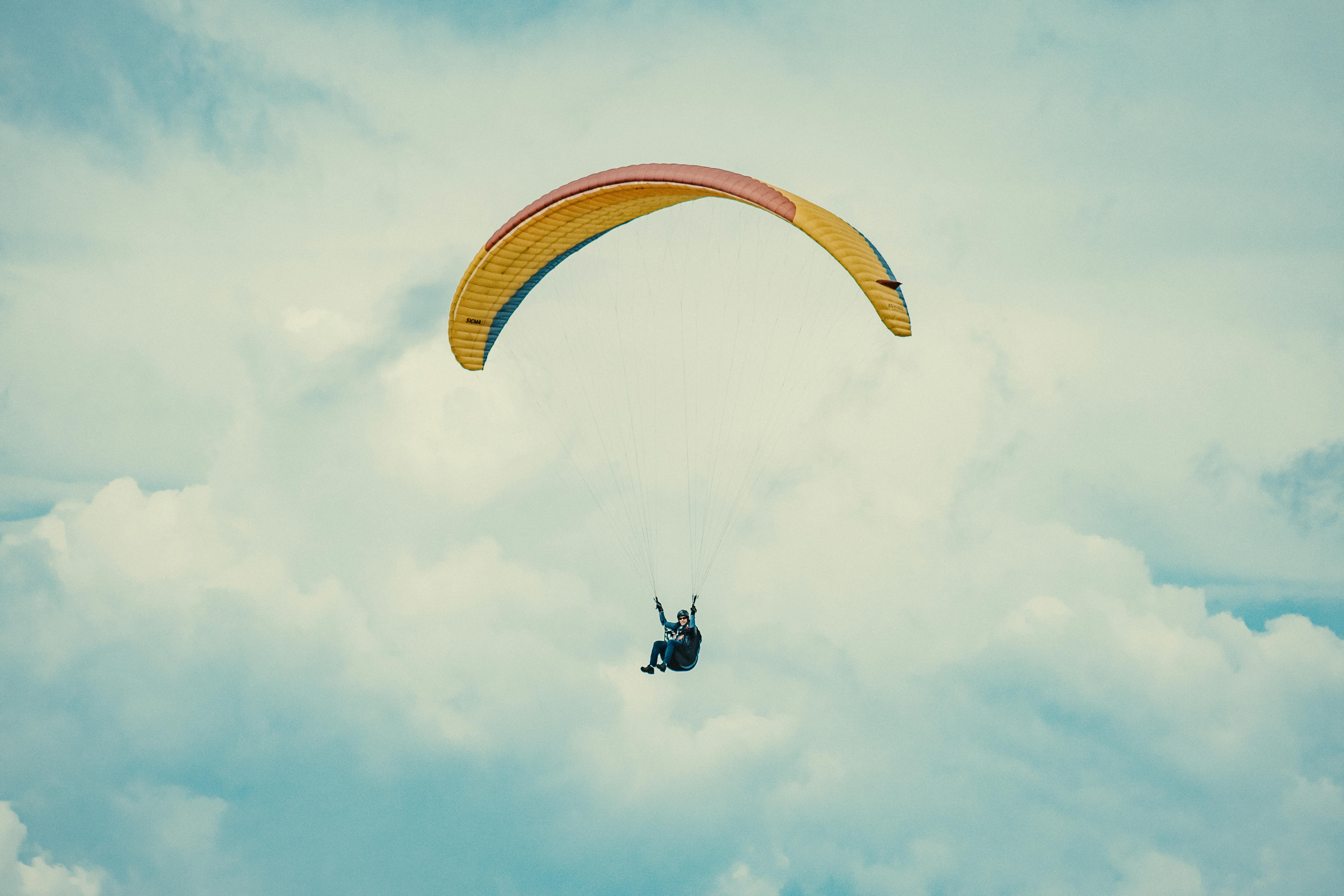 Person Riding on Parachute · Free Stock Photo