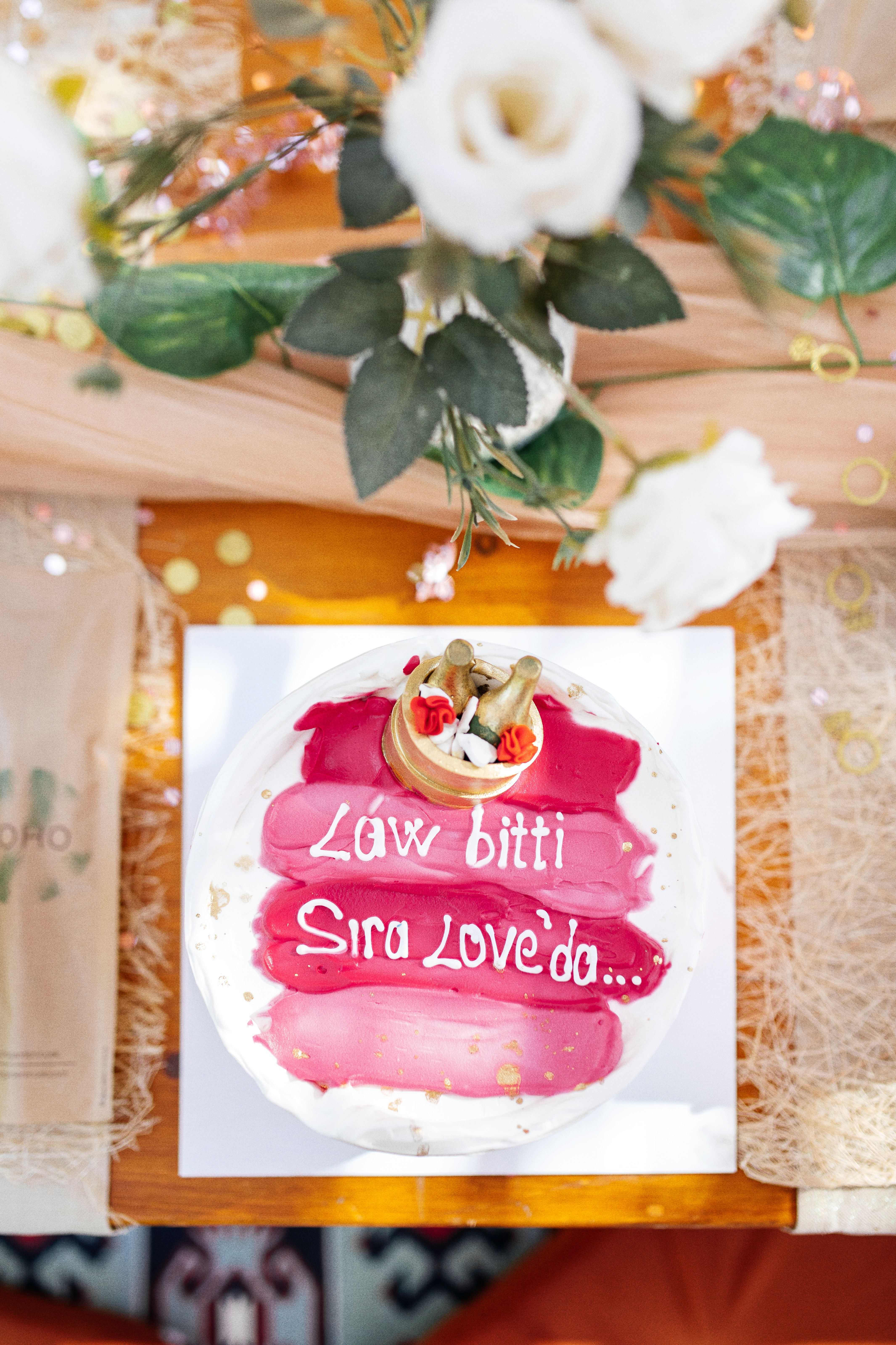 Inscription on an Iced Cake Next to White Roses · Free Stock Photo