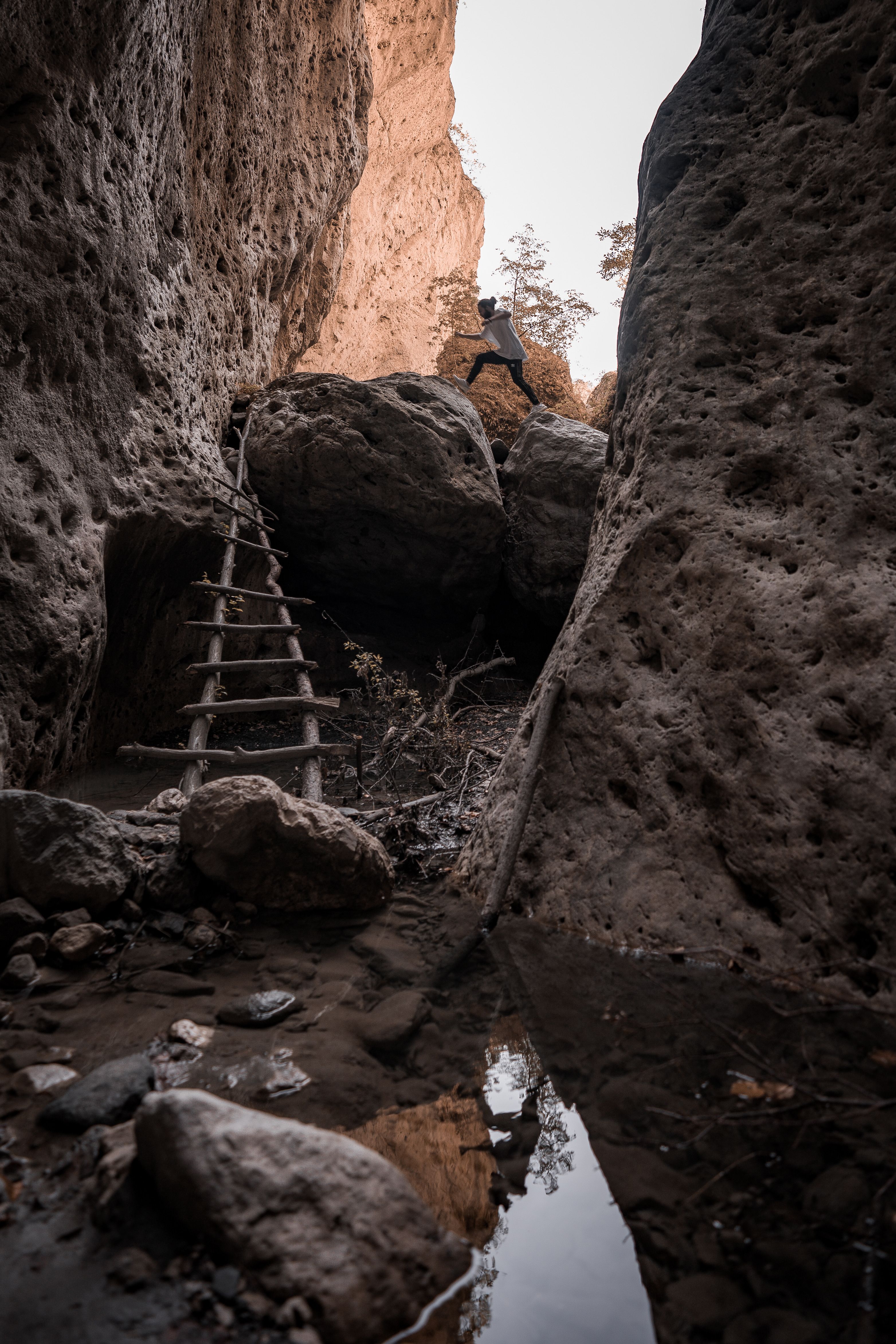 Person Walking in a Gorge between Large Stone Walls · Free Stock Photo