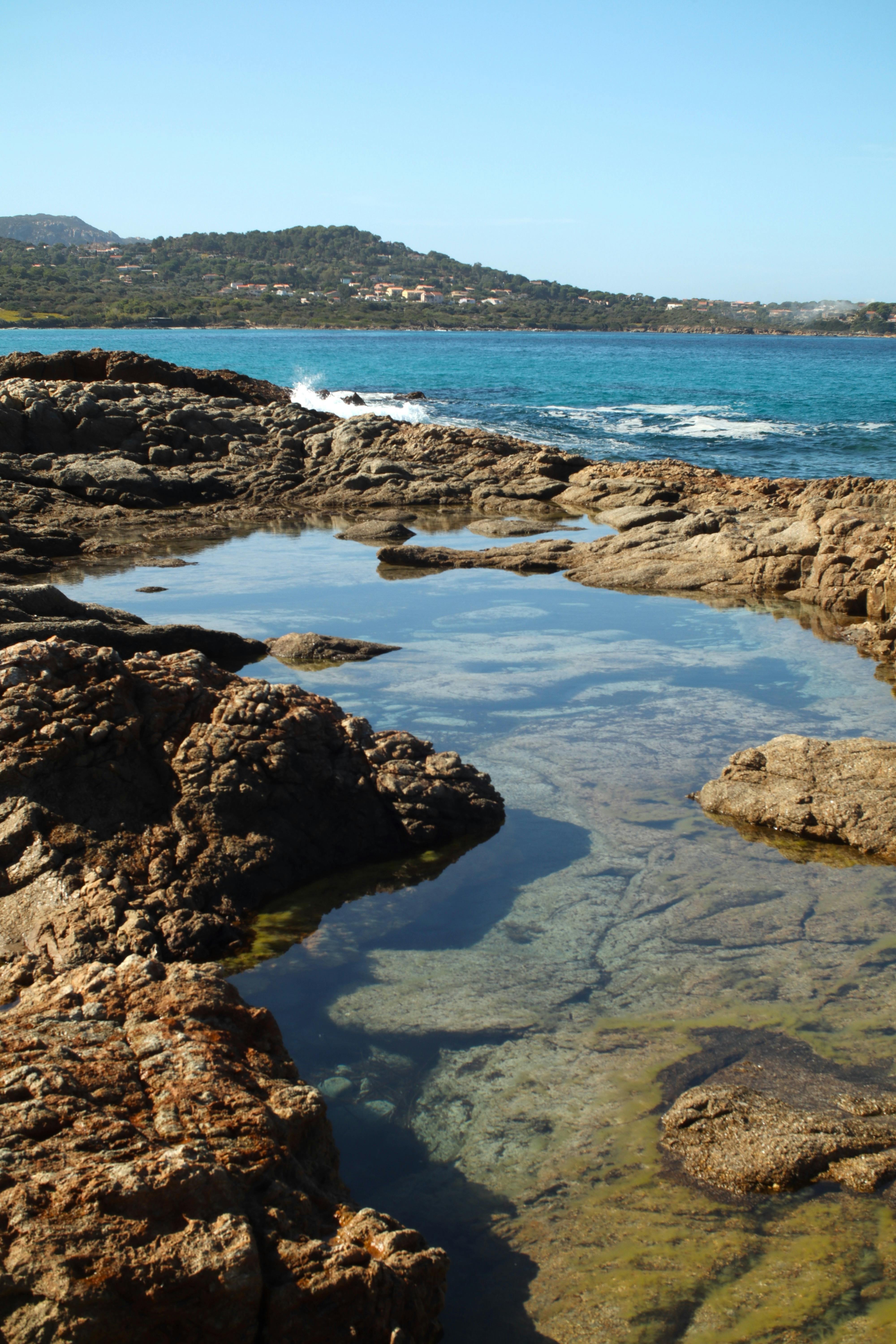 Water between Rocks on Sea Shore · Free Stock Photo