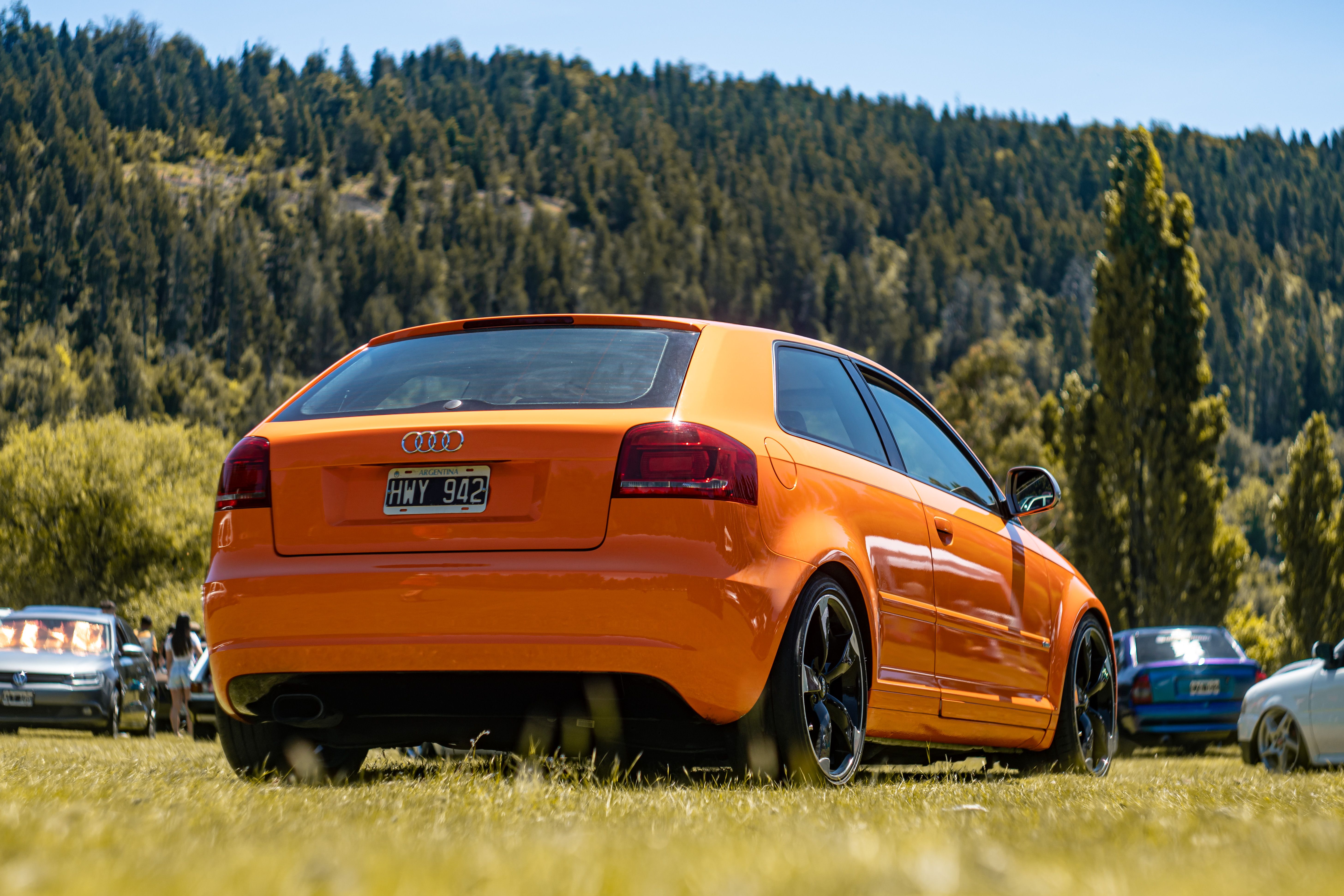 Orange Car on Meadow · Free Stock Photo
