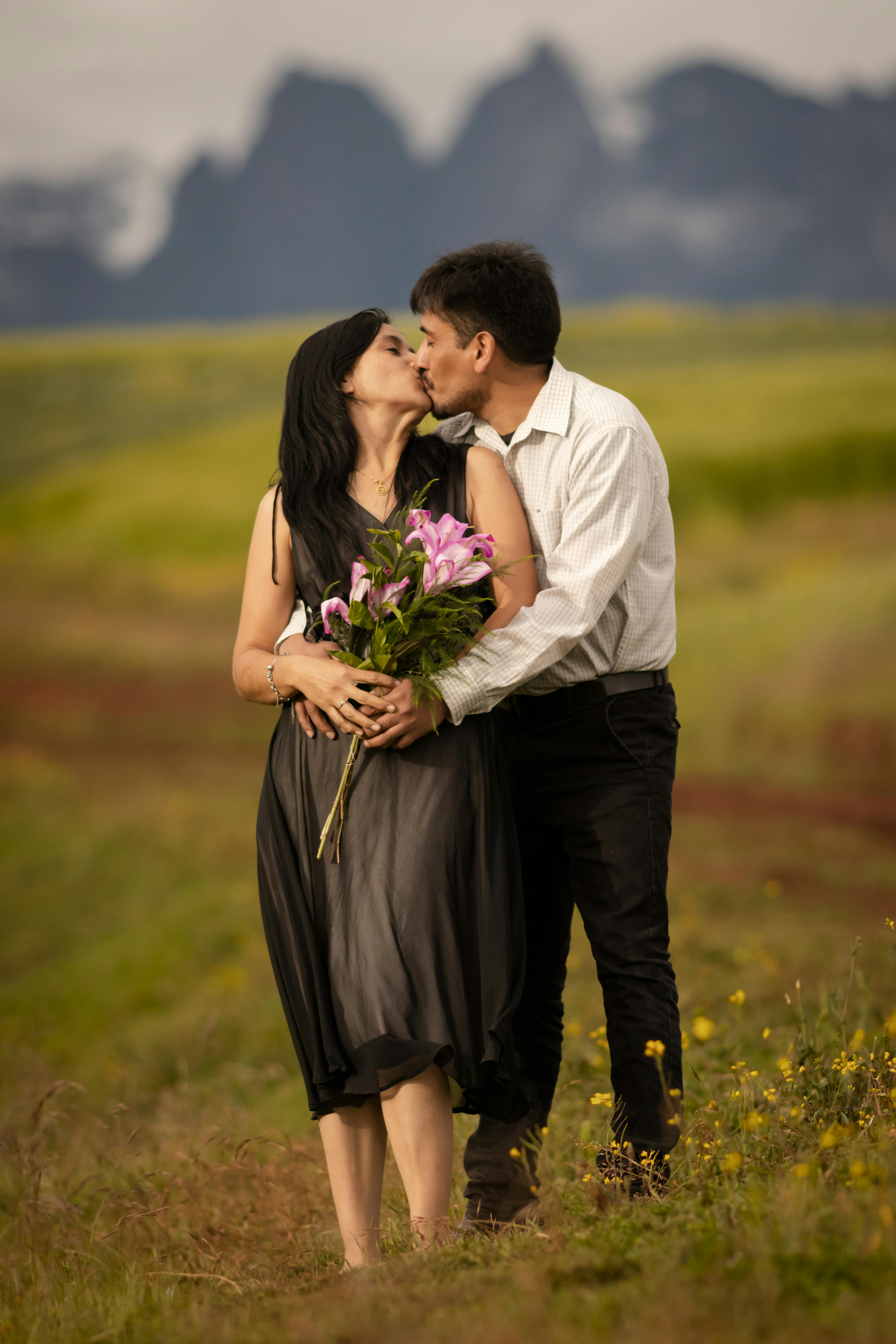 Romantic Couple Kissing during Sunset at the Beach · Free Stock Photo