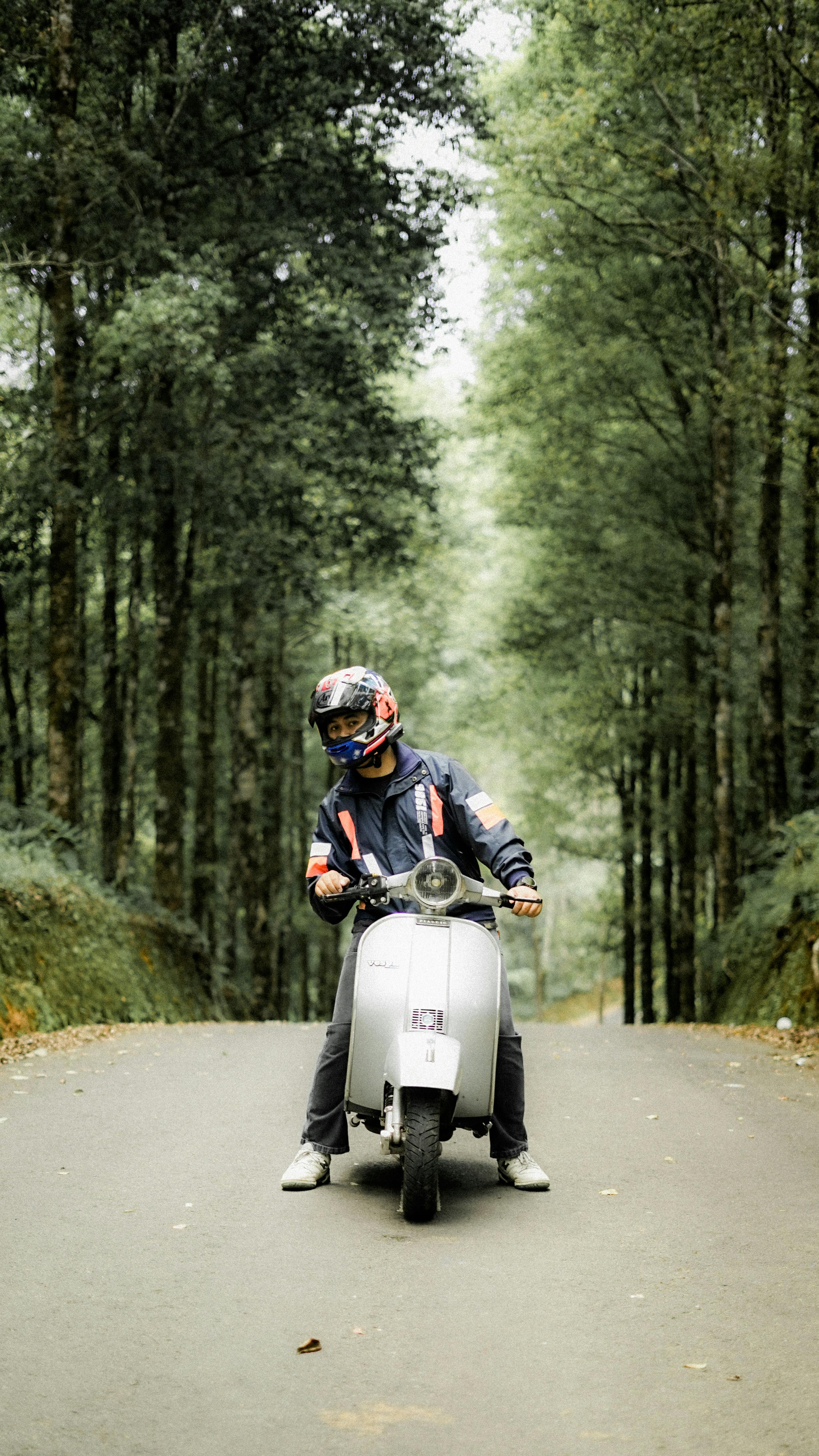 Woman Riding Motor Scooter Travelling on Asphalt Road during Sunrise ...