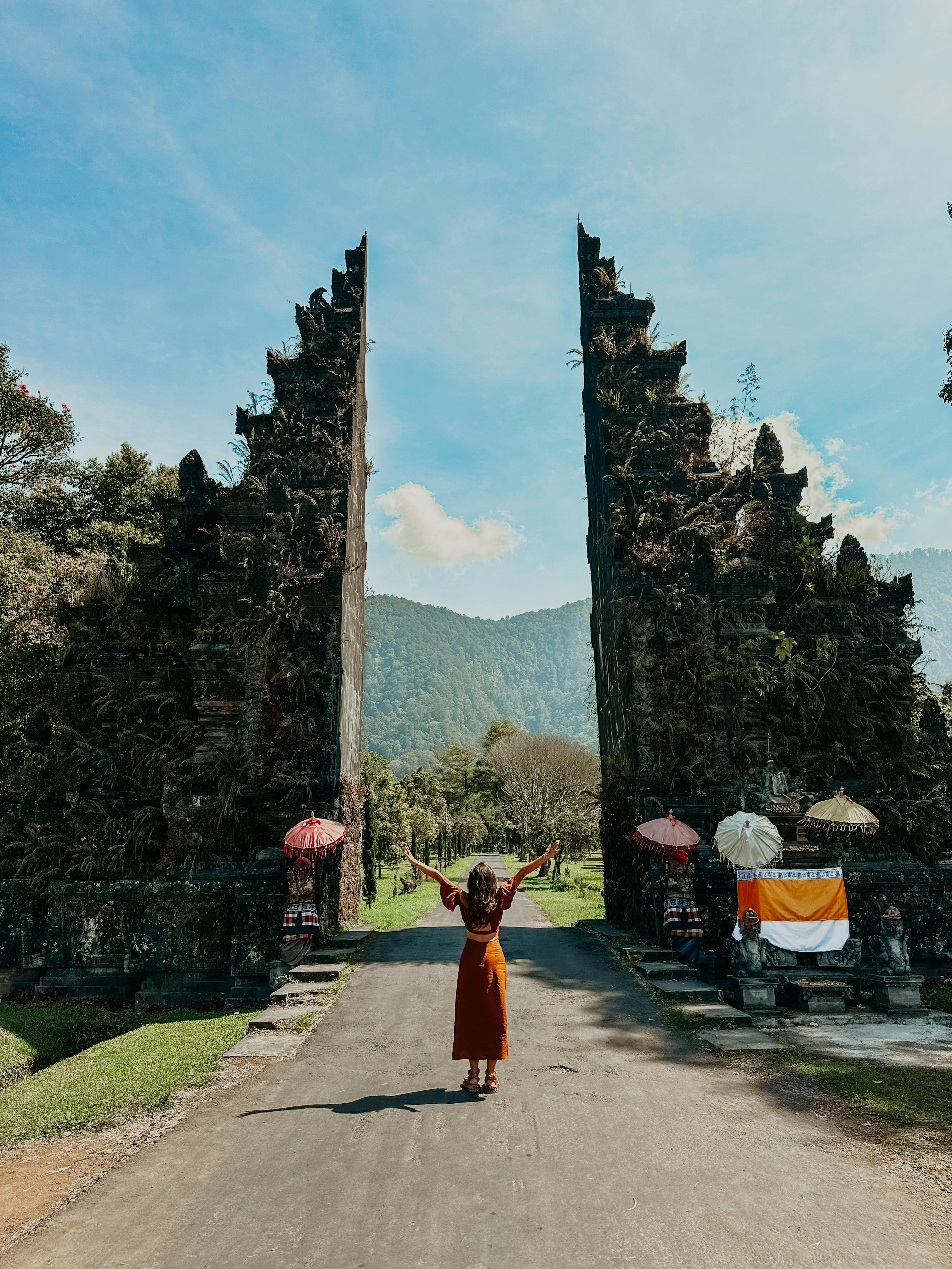Back View of a Woman Walking Towards the Famous Bali Handara Gate ...