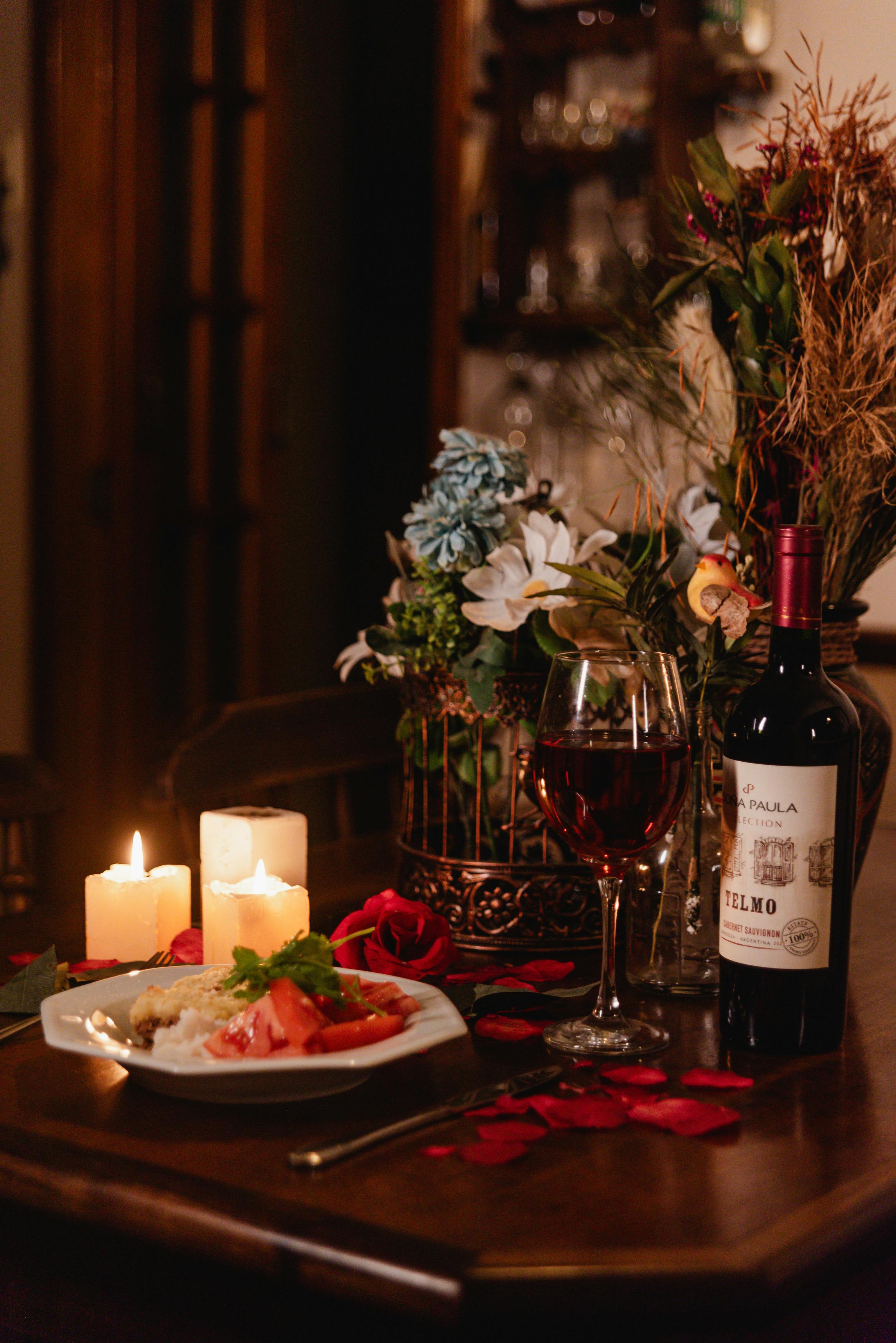 Elegant Dinner on a Table with Flowers and Wine · Free Stock Photo