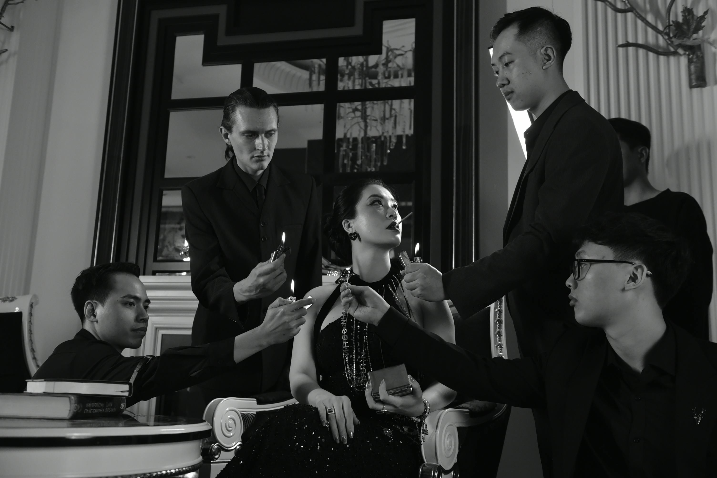 Men with Lighters around Elegant Woman with Cigarette · Free Stock Photo