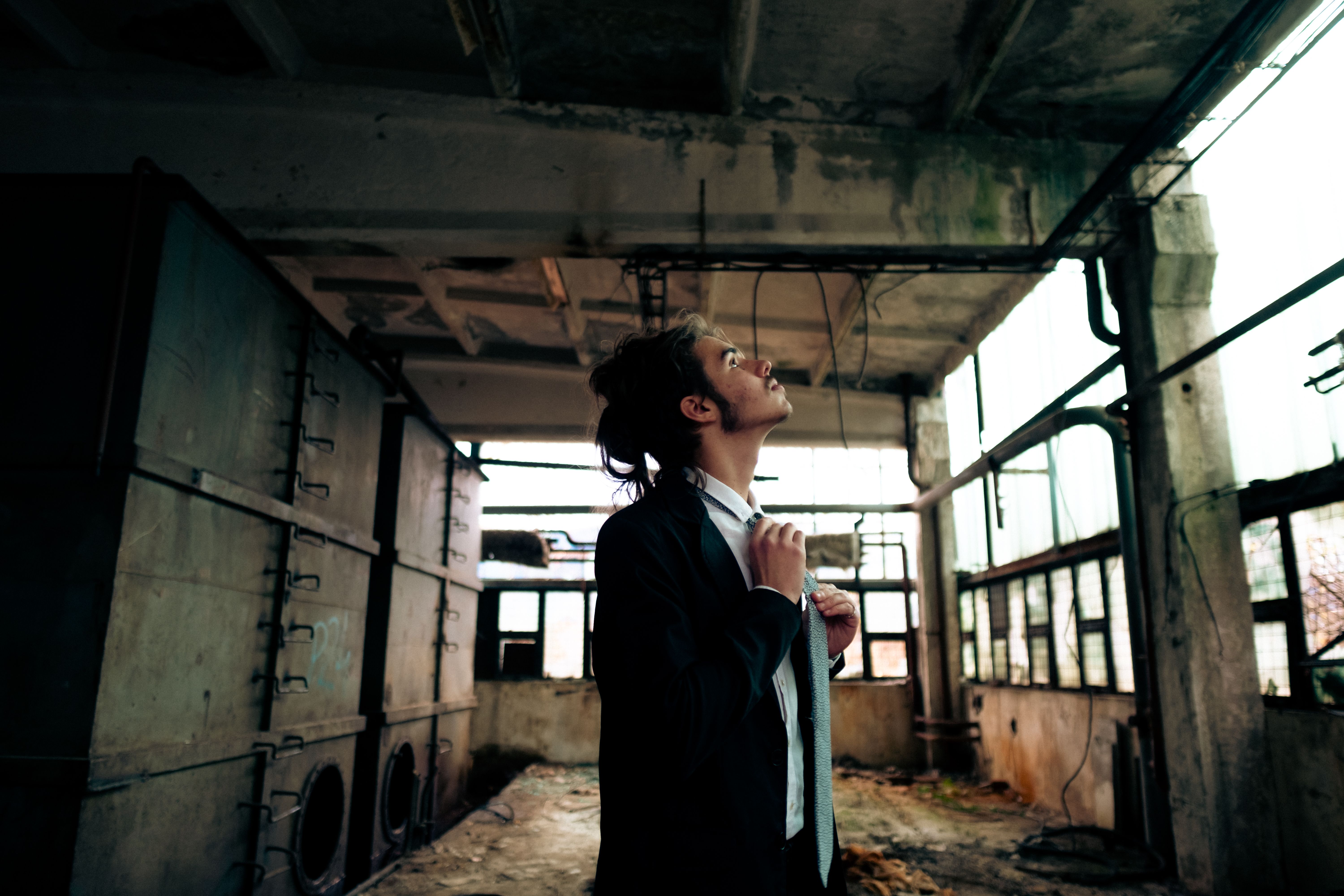 A Man Standing in an Abandoned Building · Free Stock Photo