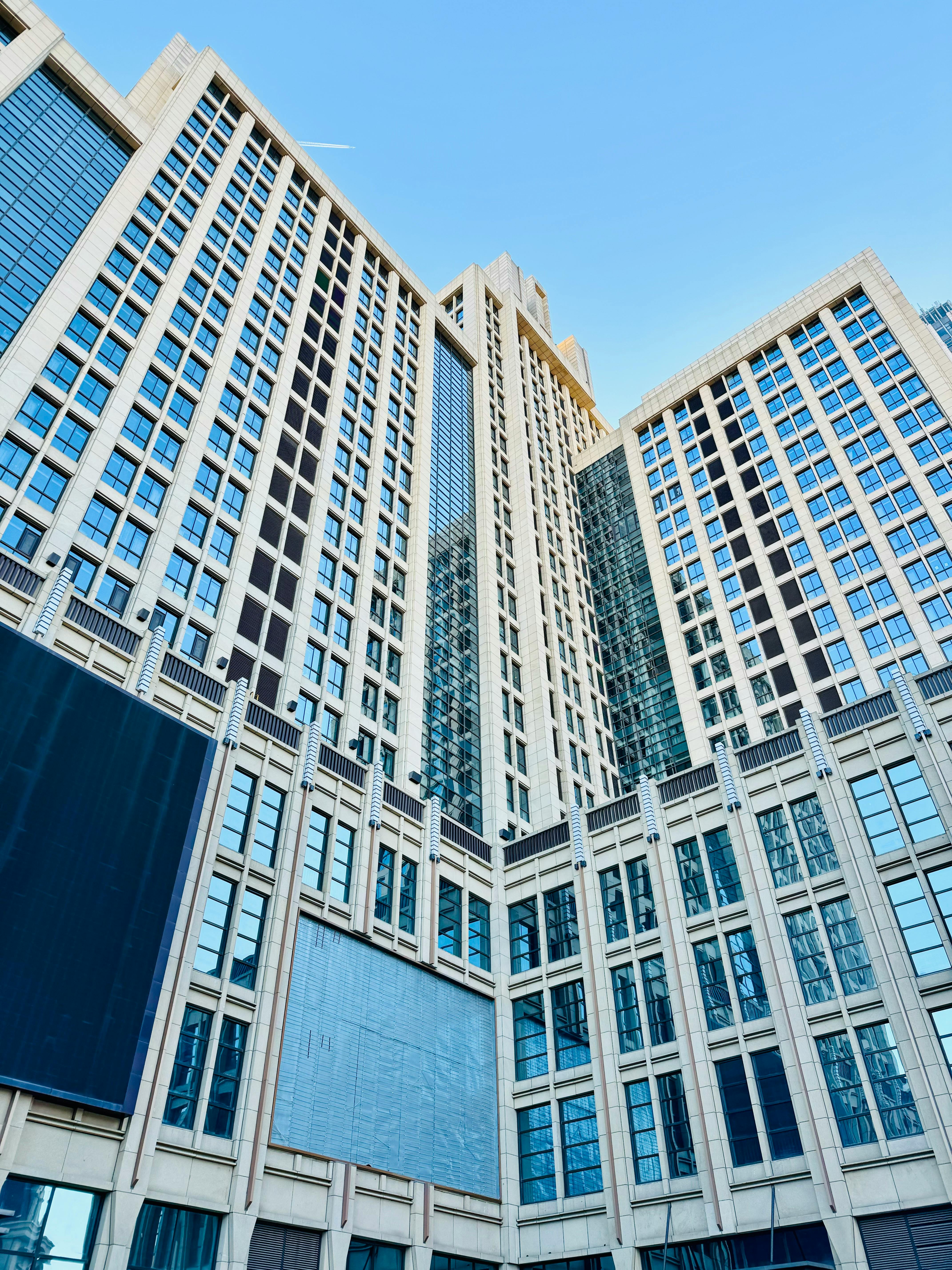 Low Angle Photo Of High-Rise Building During Nighttime · Free Stock Photo