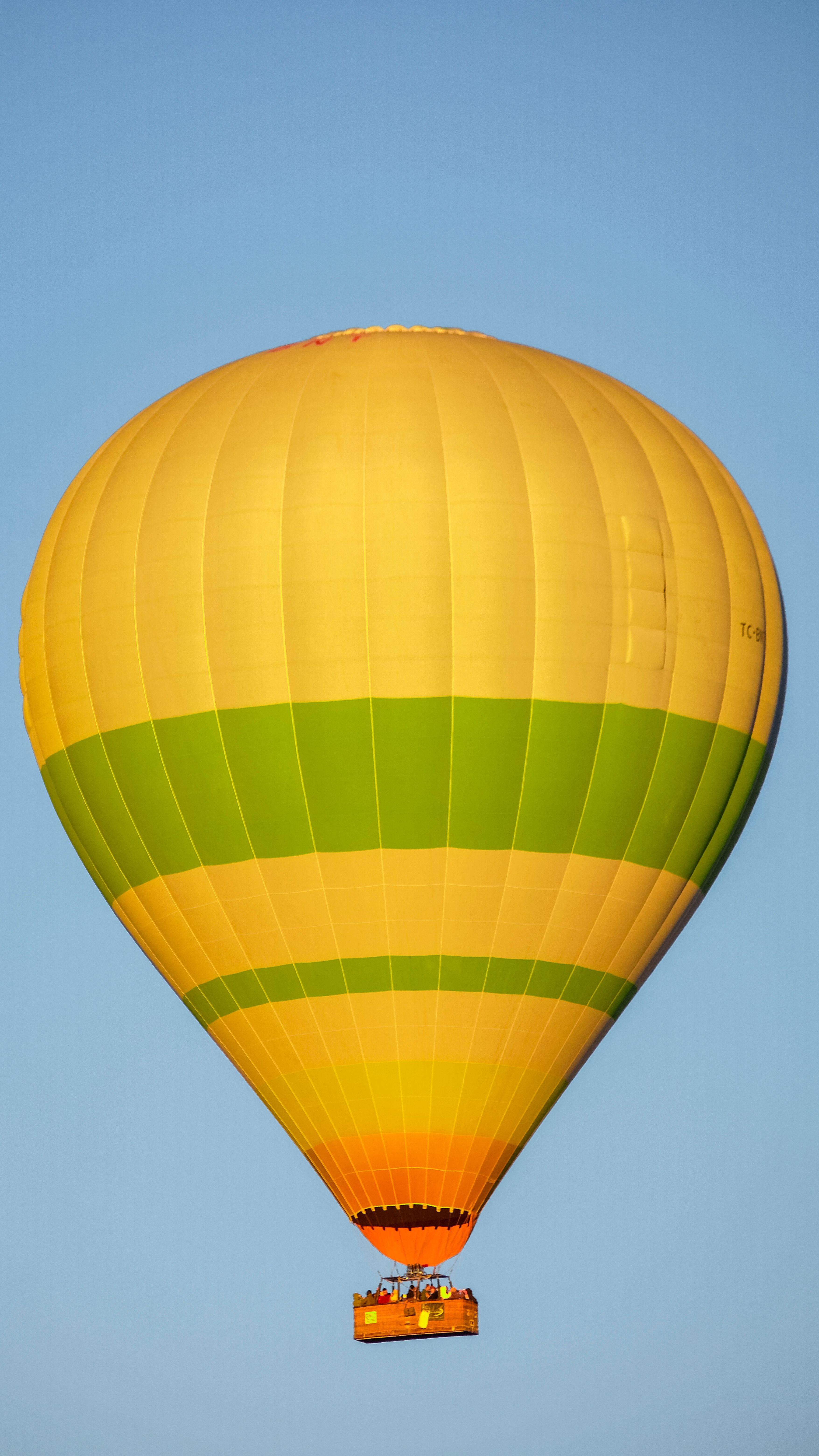 Yellow and Green Hot-Air Balloon in Blue Sky · Free Stock Photo