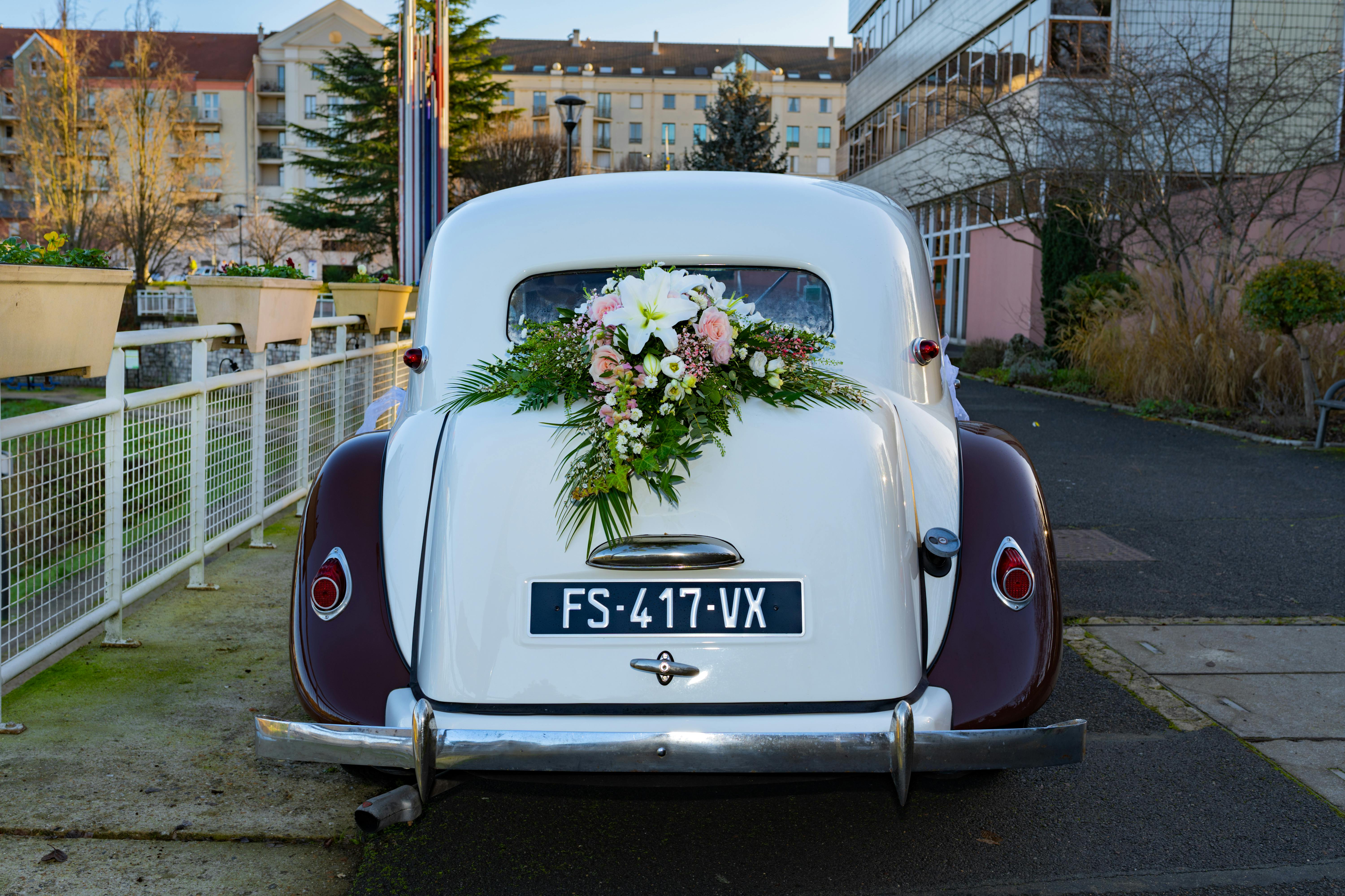 Back of a Vintage Car with Flower Decorations · Free Stock Photo