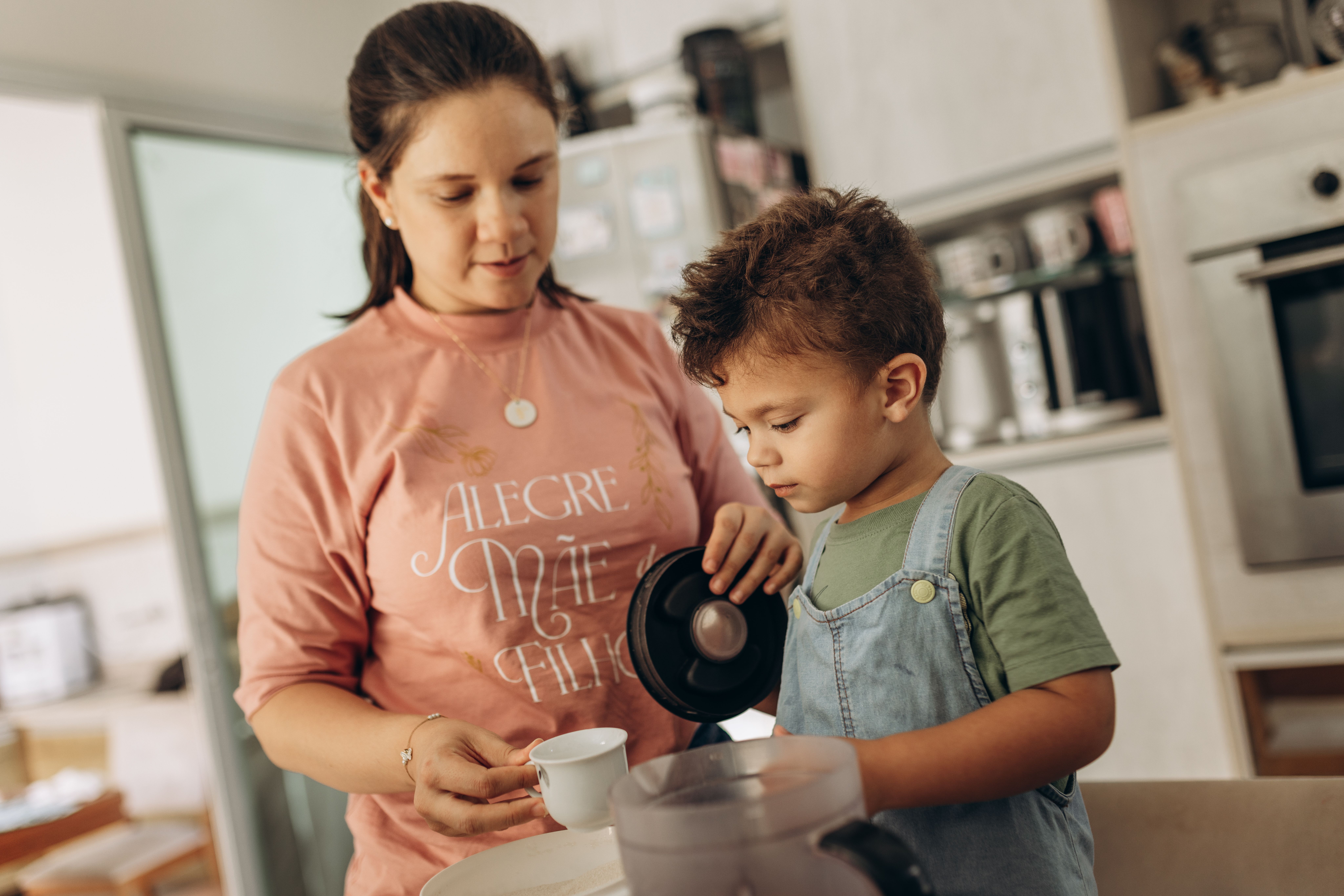 Mother Helping her Son to get Changed · Free Stock Photo