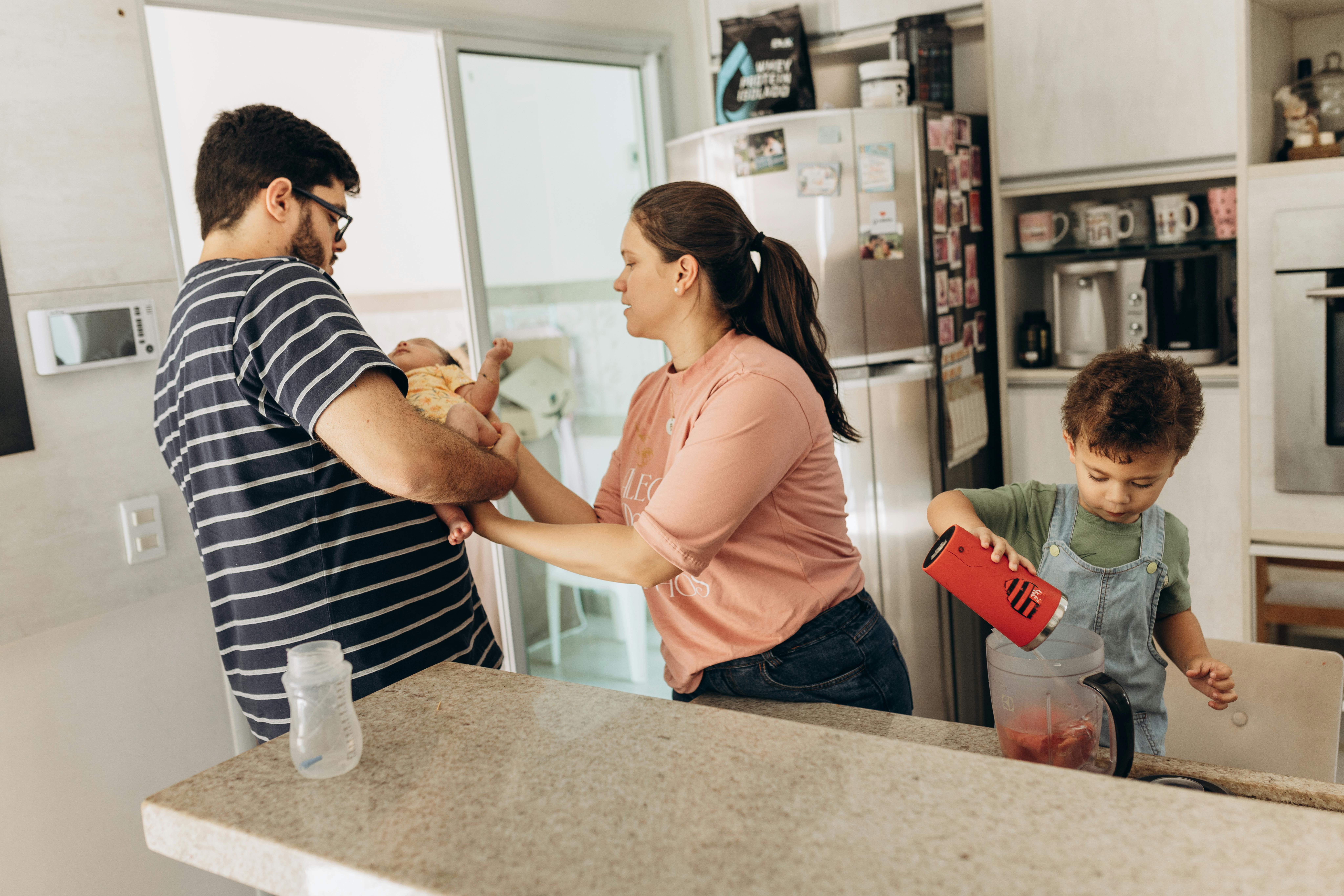Couple with Son and Baby in Kitchen · Free Stock Photo