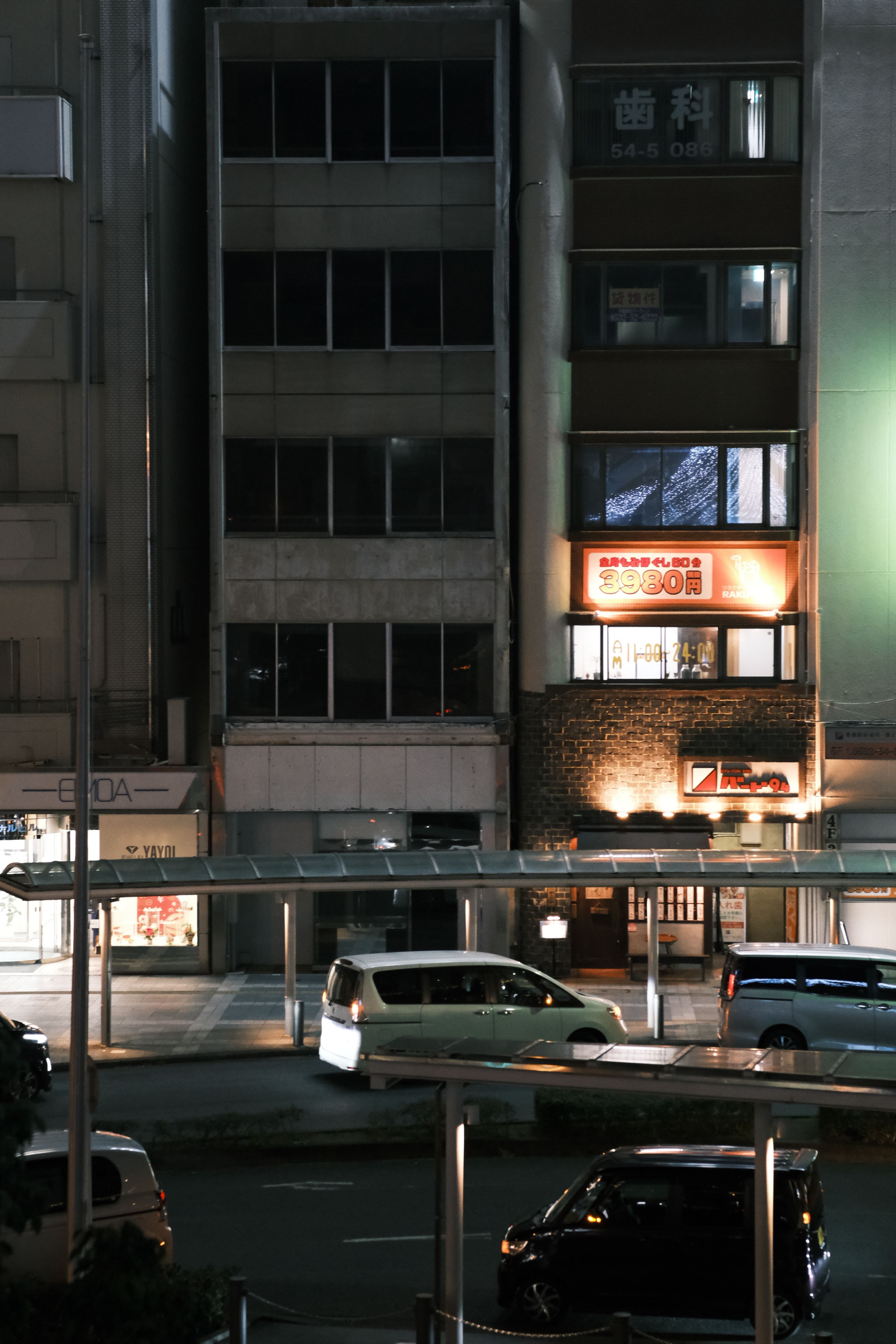 Cars Driving on a Japanese City Street at Night · Free Stock Photo
