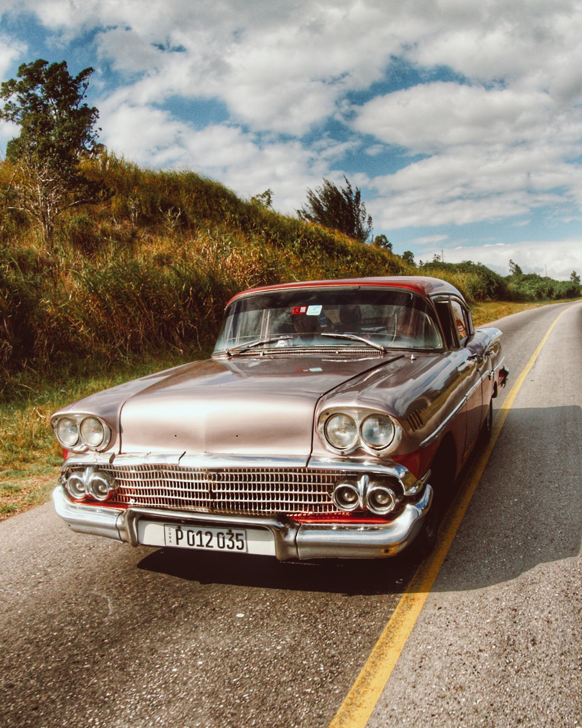 Classic Car on Rural Road · Free Stock Photo