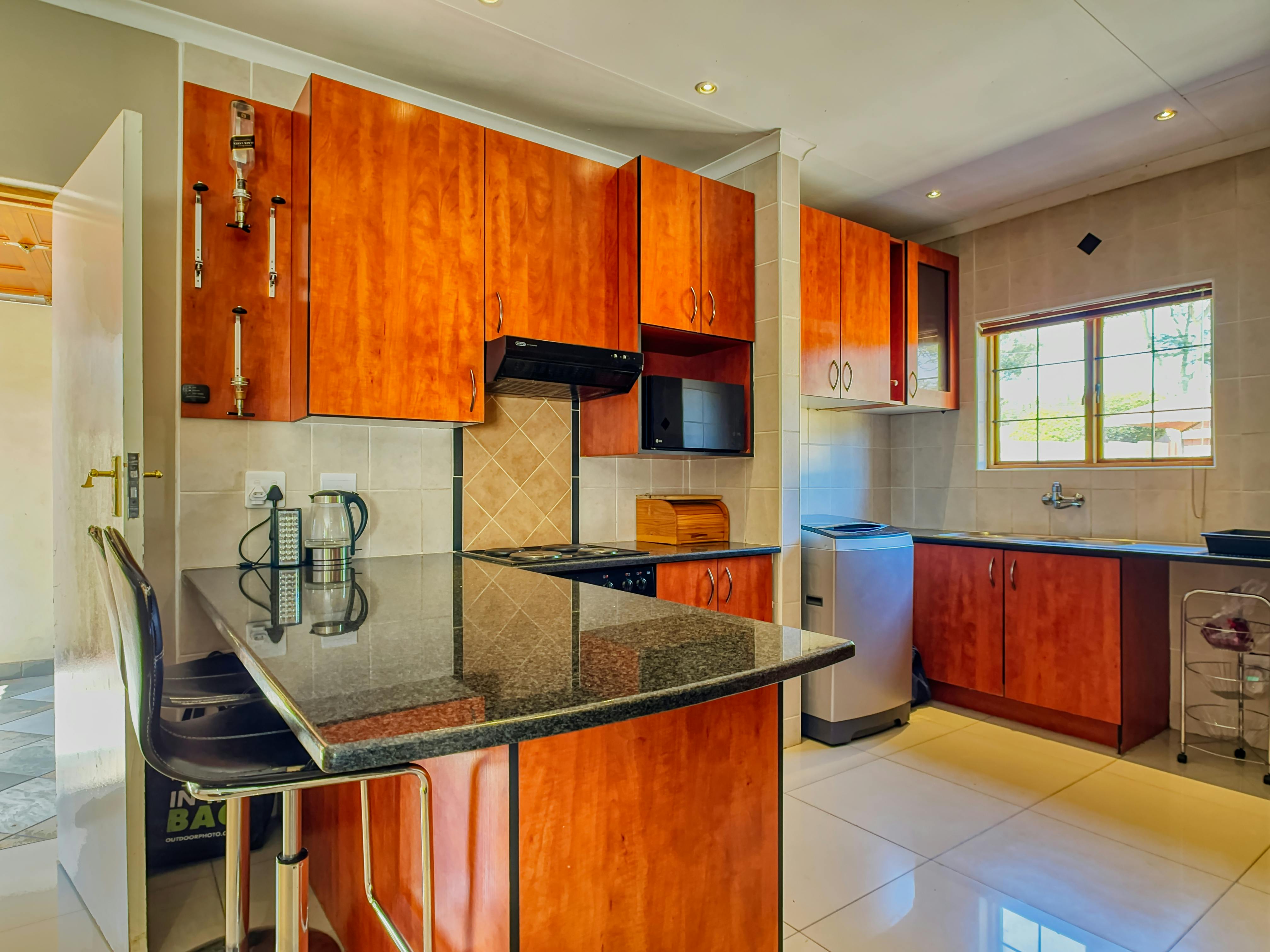 Kitchen with Brown Cupboards · Free Stock Photo