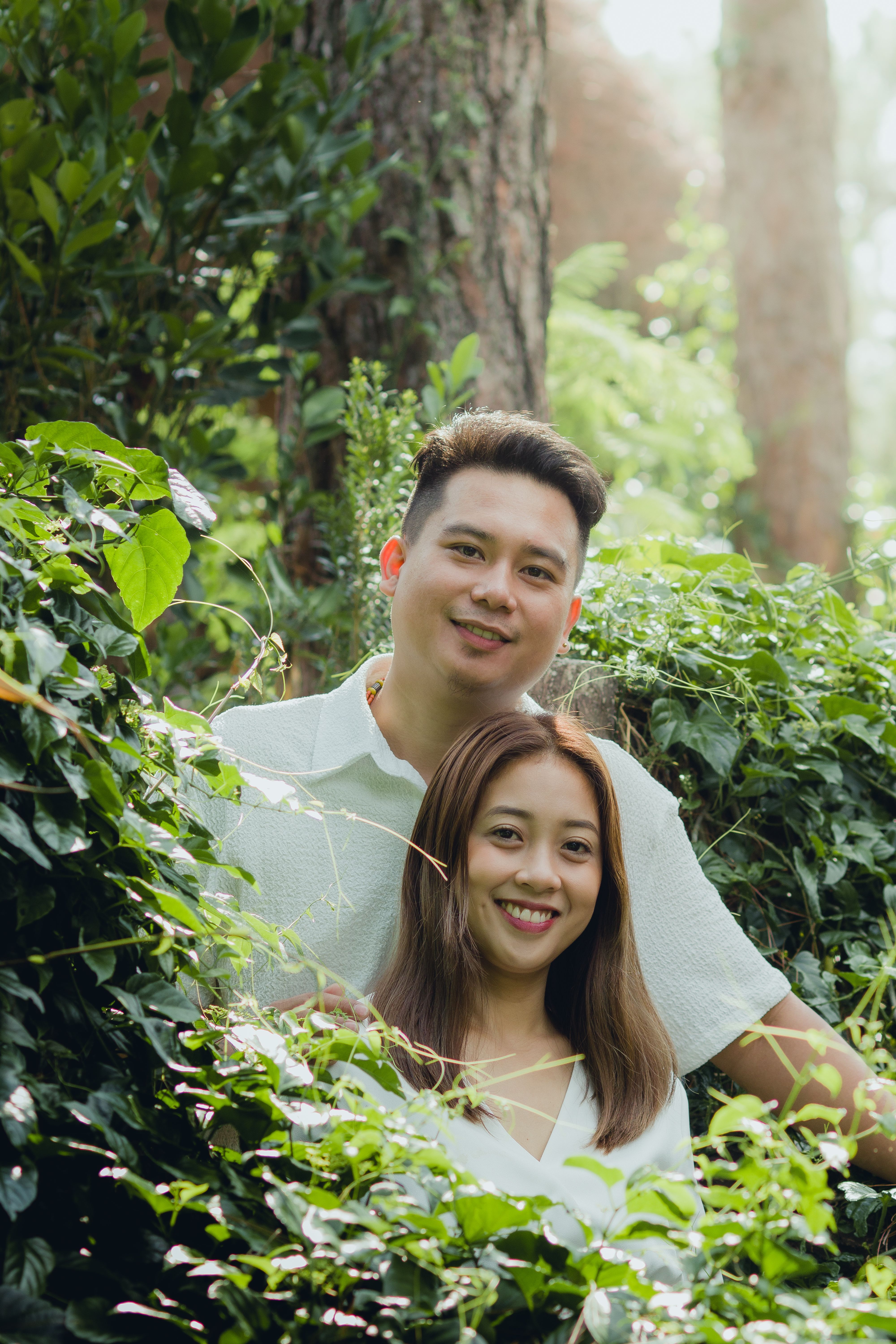 Smiling Couple among Leaves in Forest · Free Stock Photo