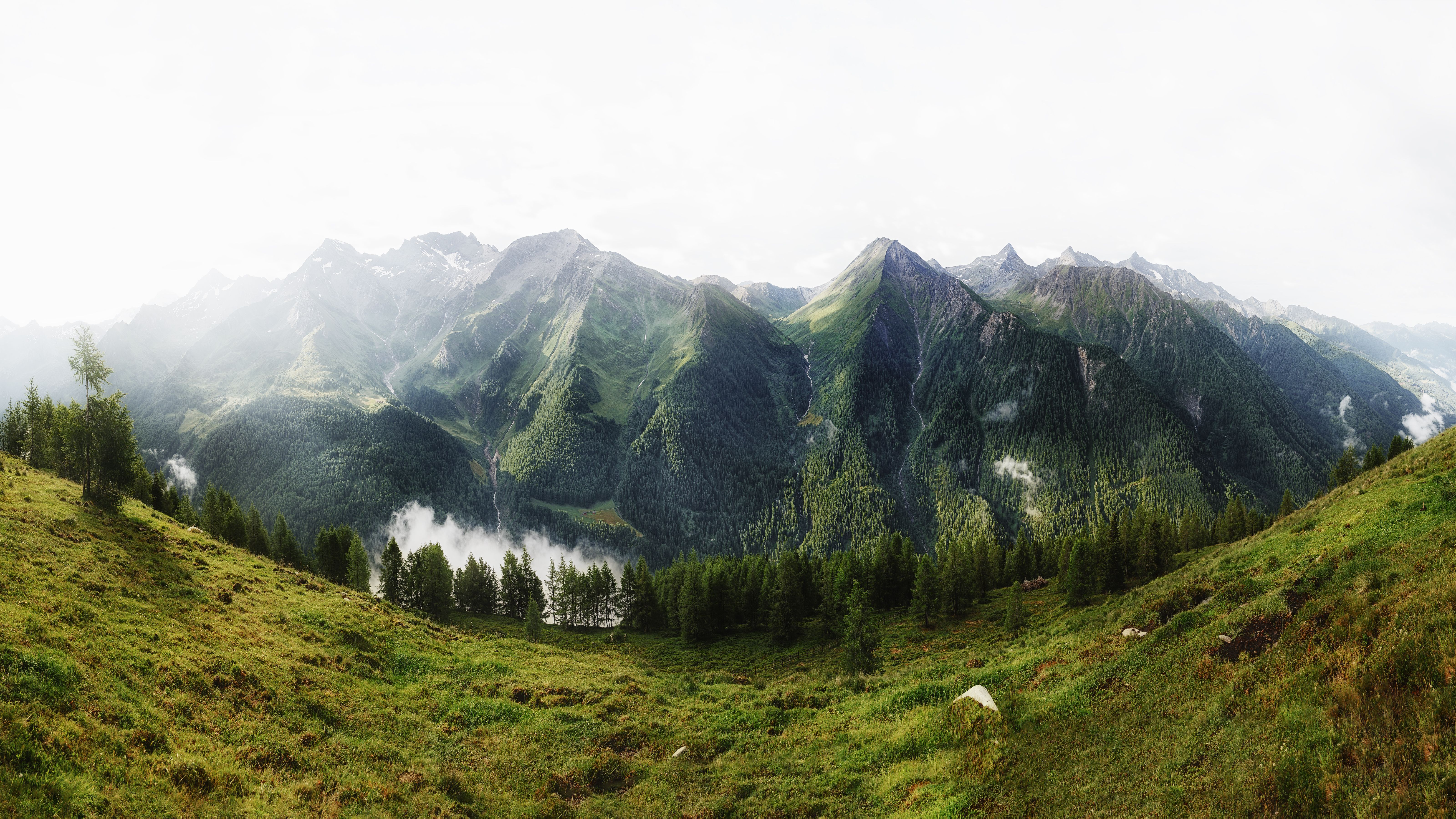 View of a Grass Field and Mountains · Free Stock Photo