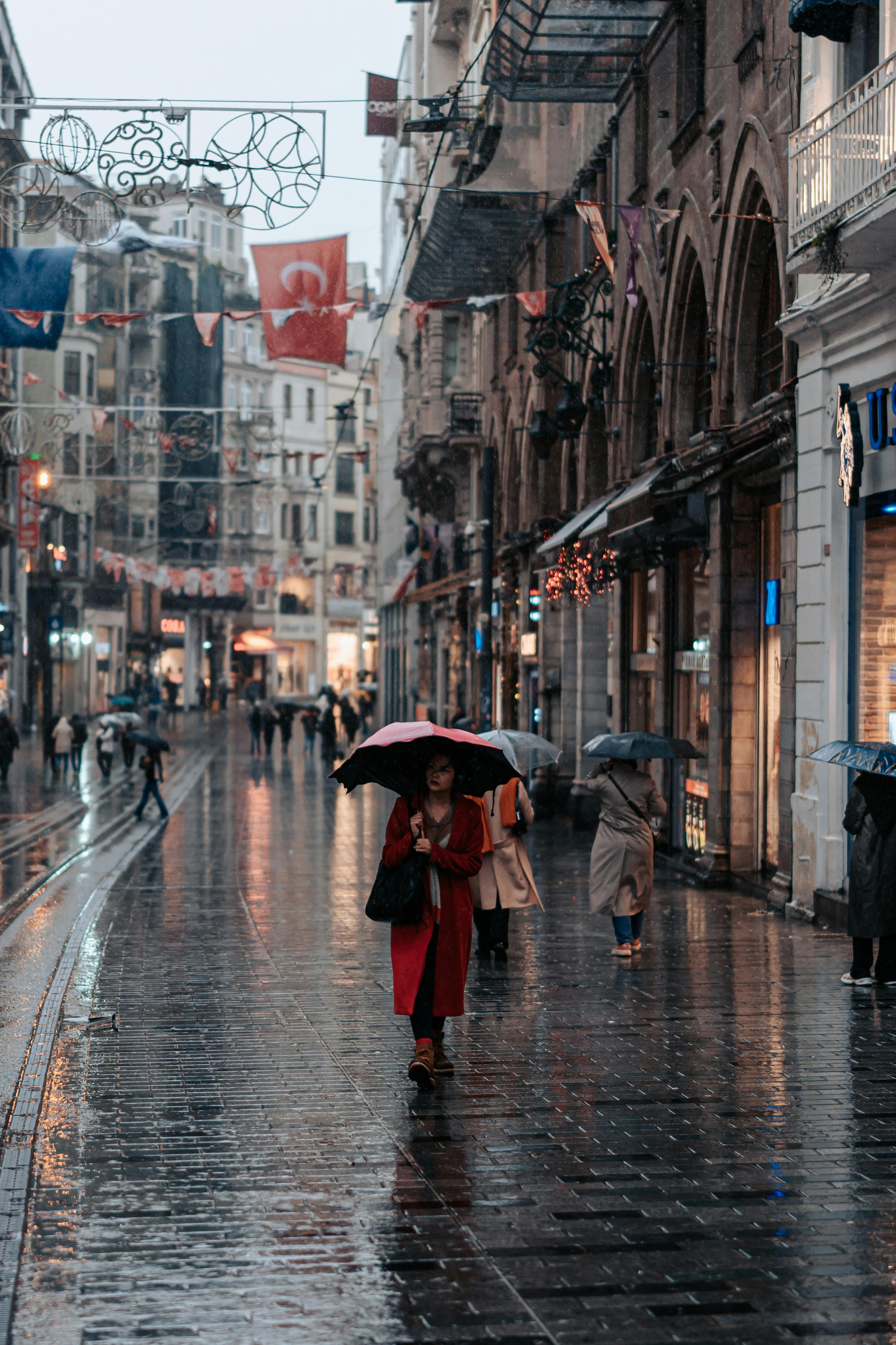 Pedestrians Walking with Umbrellas on the Streets of Istanbul in Rain ...