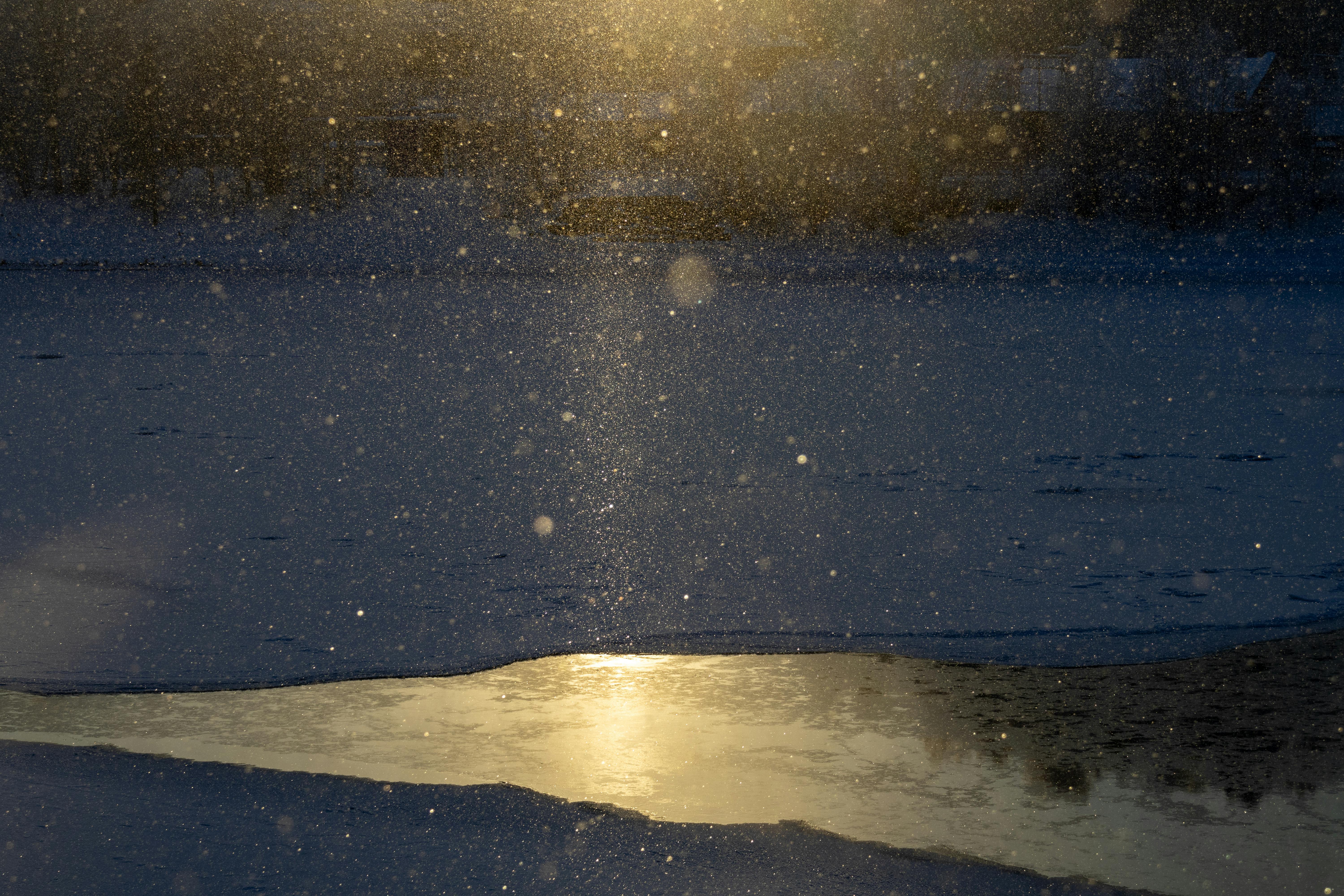 Snowfall over Lake at Sunset · Free Stock Photo