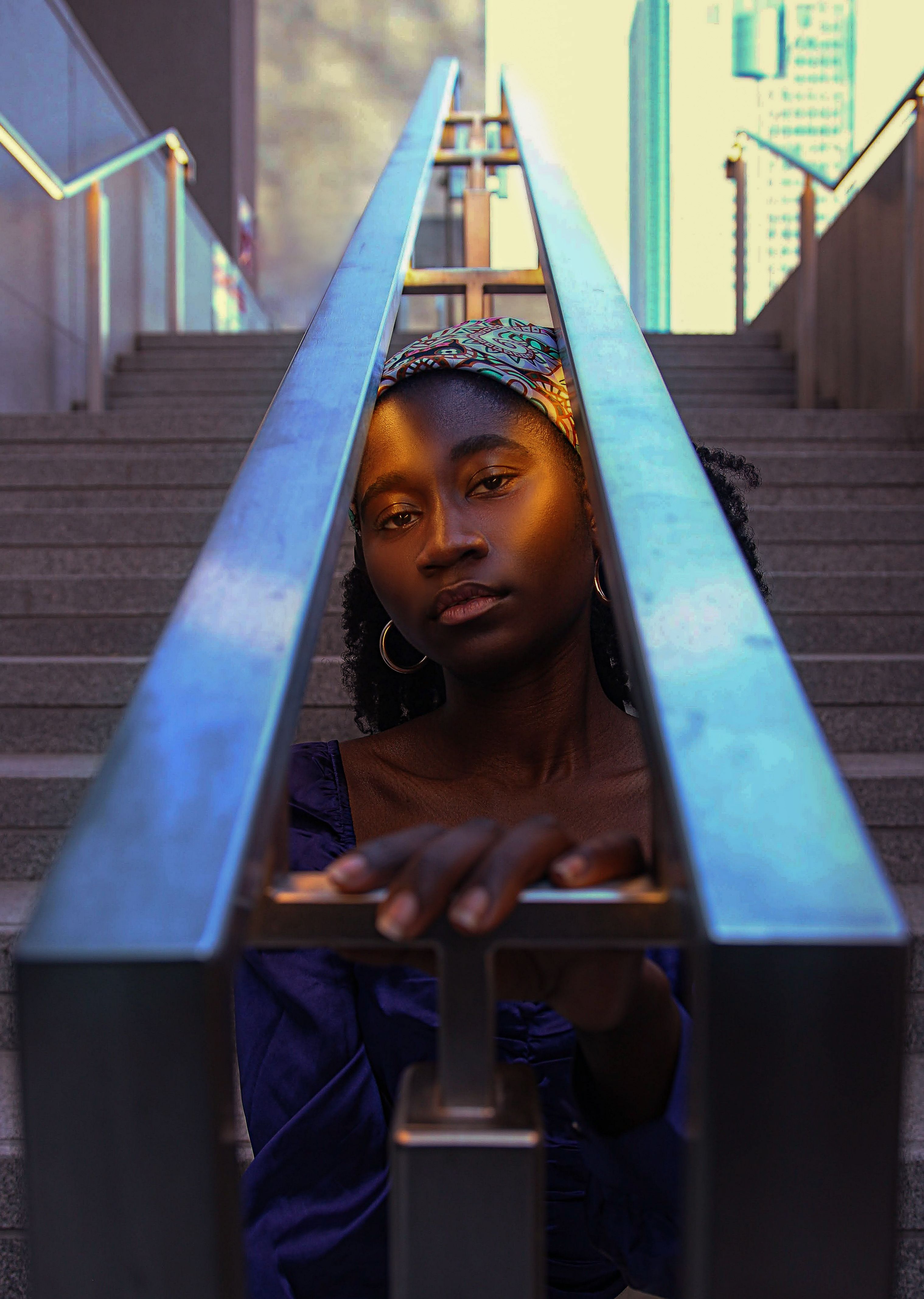 Woman Sitting under Handrails · Free Stock Photo