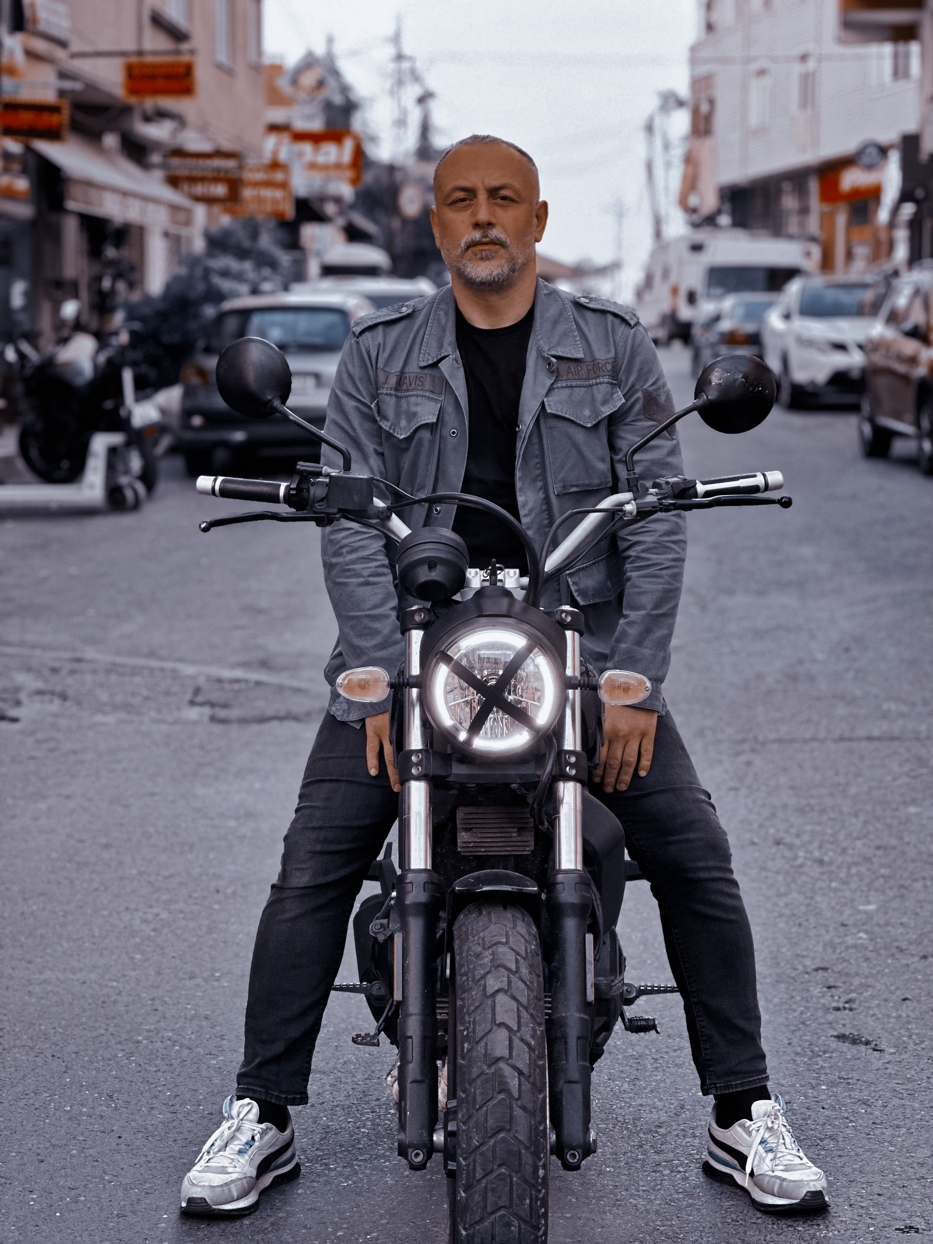 Man Sitting and Posing on a Motorcycle · Free Stock Photo