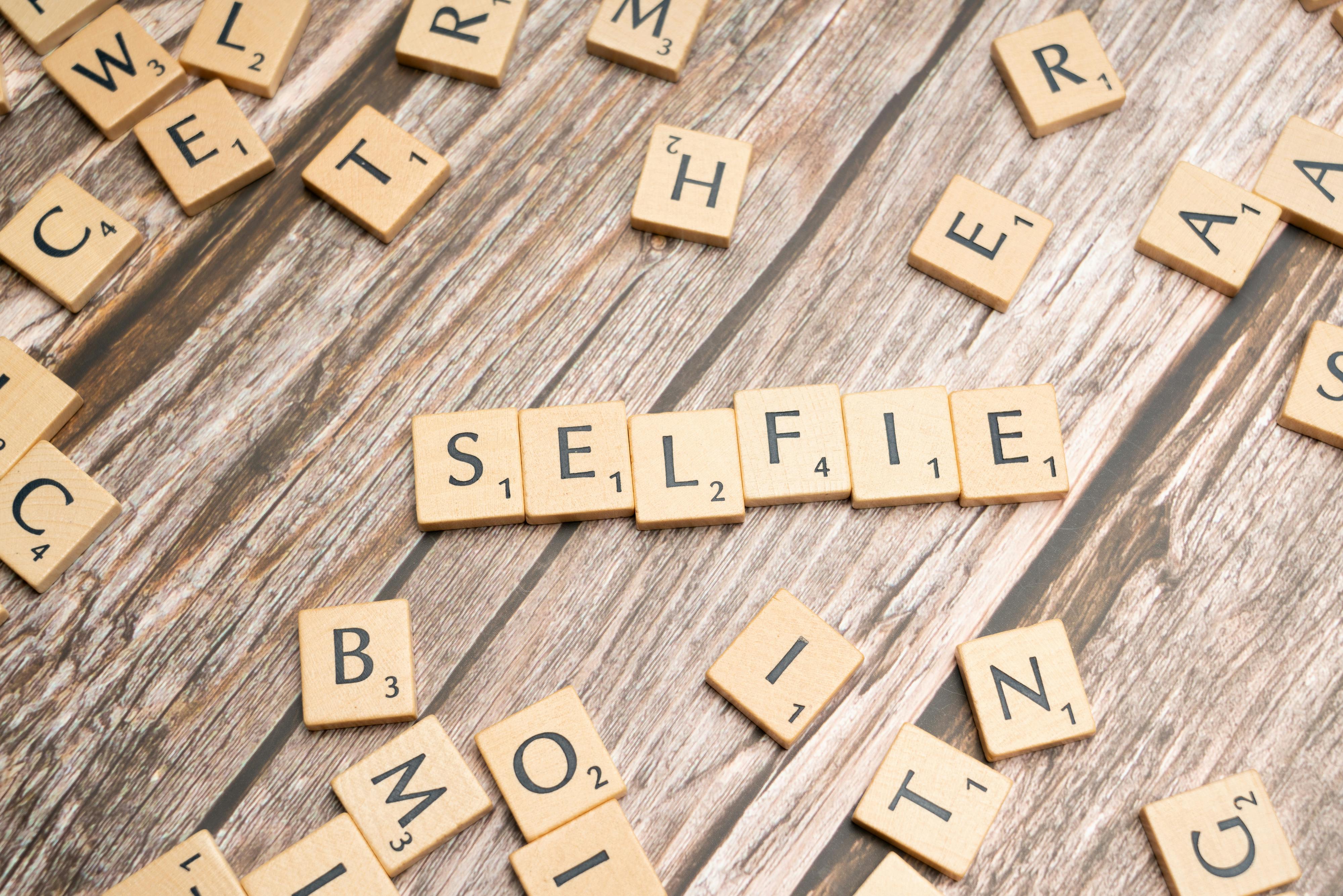 The word selfie spelled out in scrabble letters · Free Stock Photo