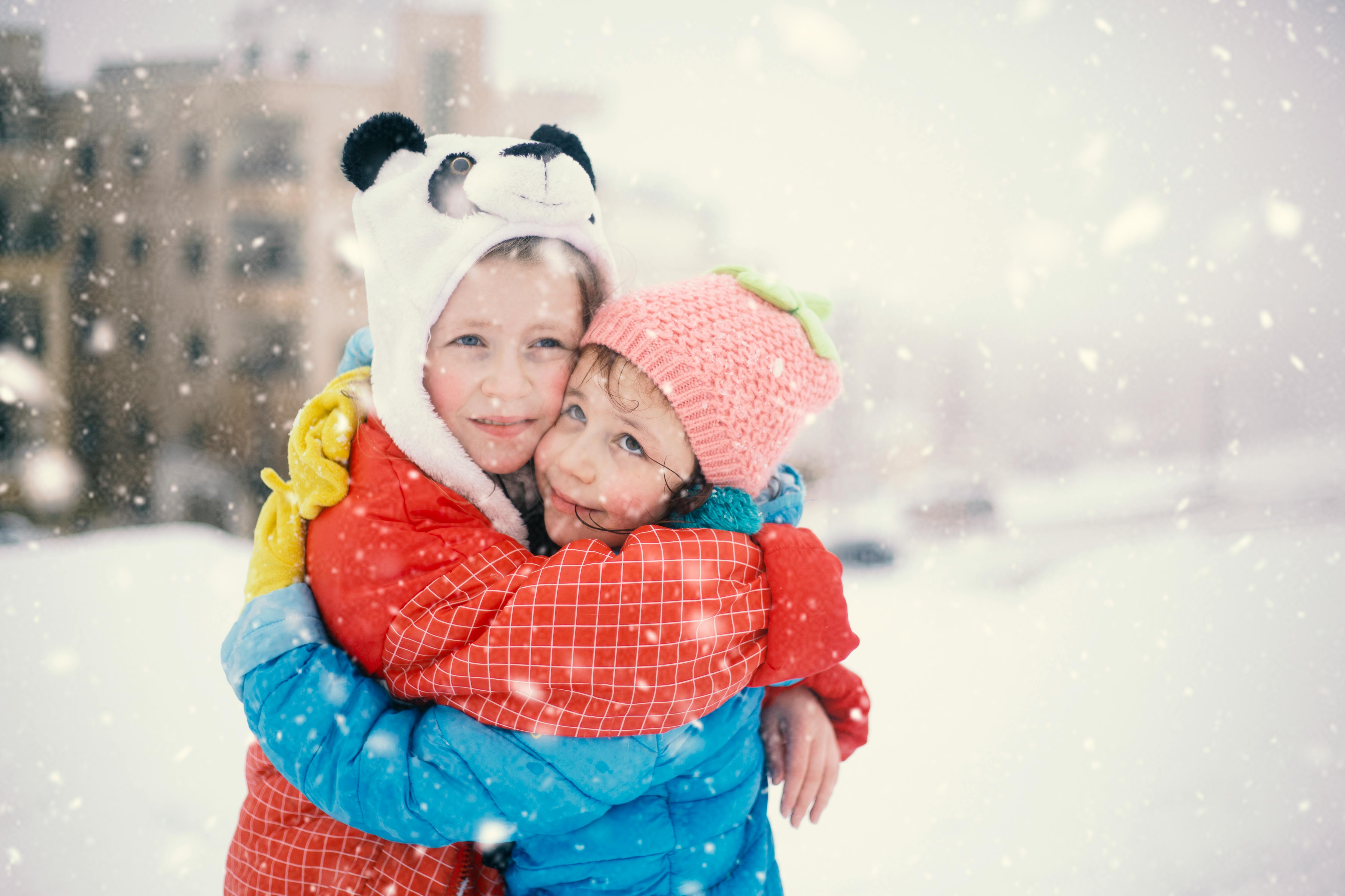 Children Hugging in Winter · Free Stock Photo