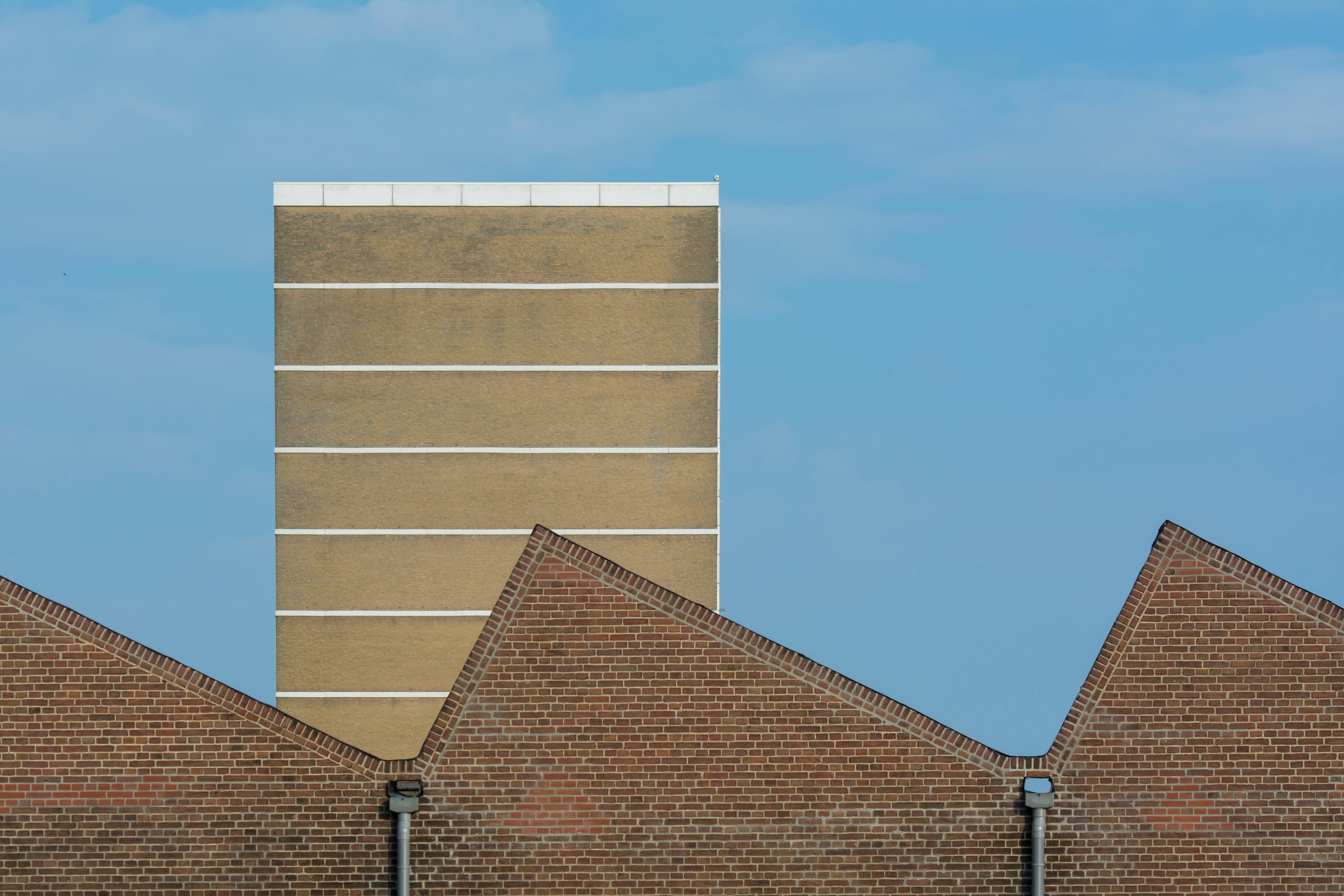 Brick Rooftop in Front of Blue Sky · Free Stock Photo