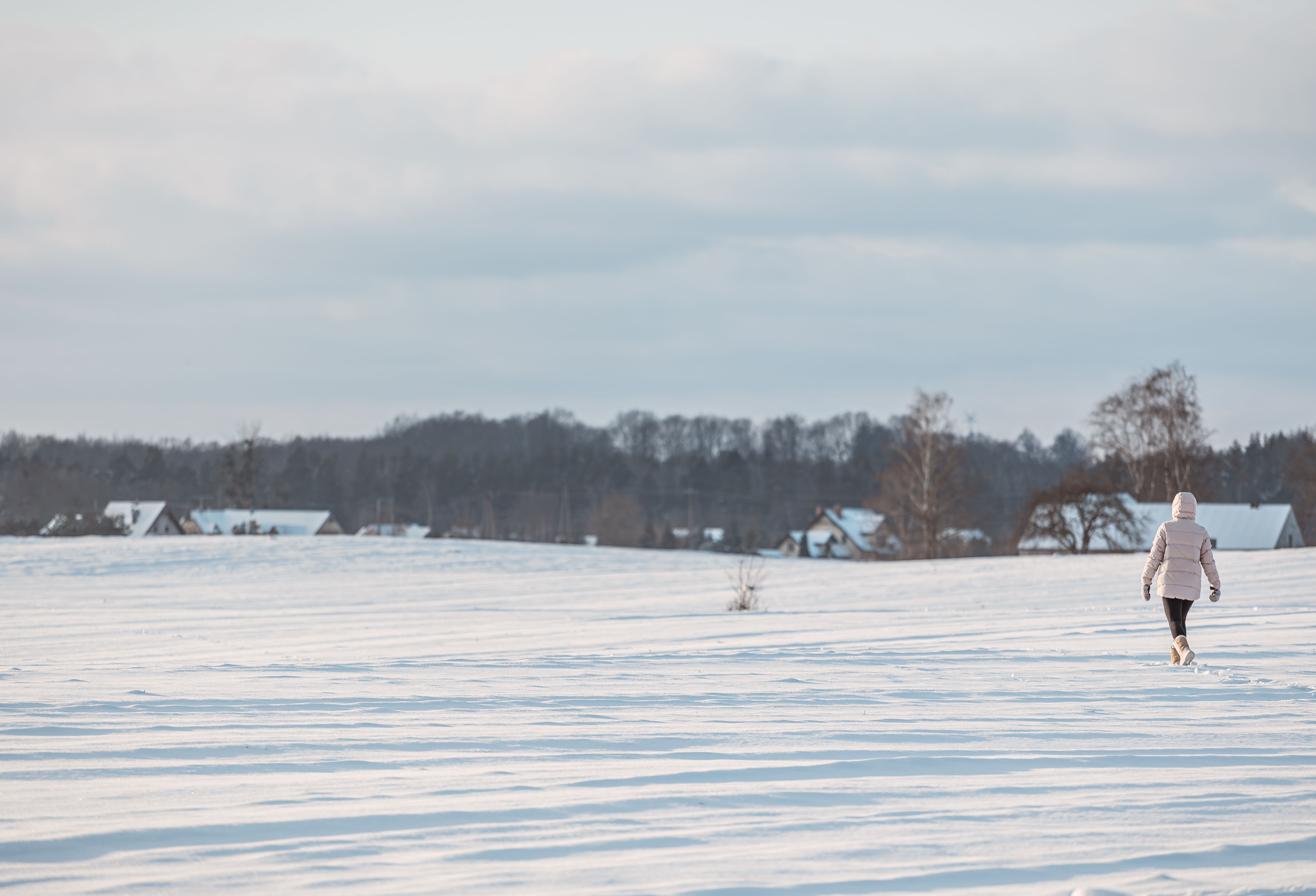 Person in Jacket Walking in Countryside in Winter · Free Stock Photo
