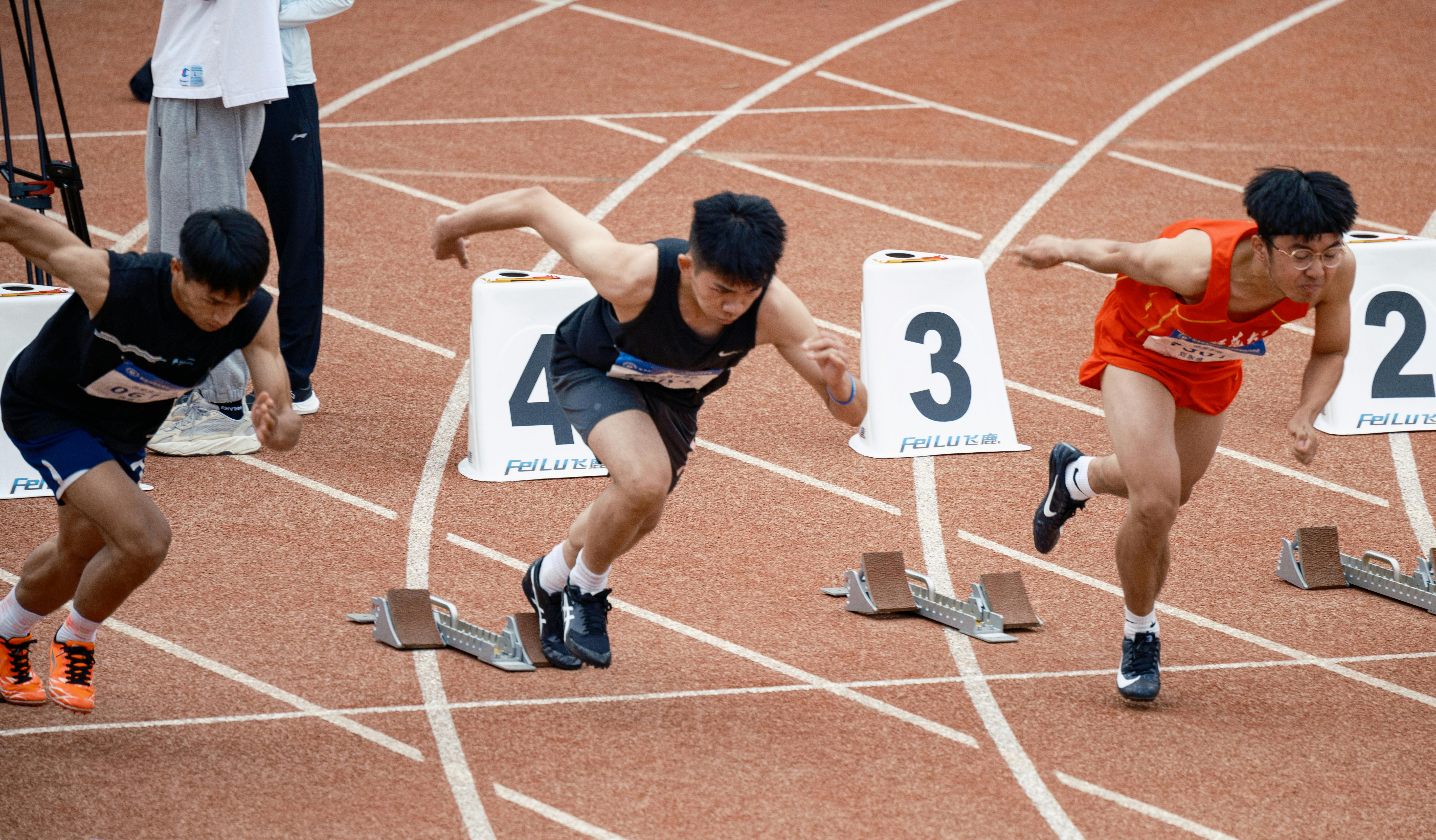 Athletes Running on Track and Field Oval in Grayscale Photography ...