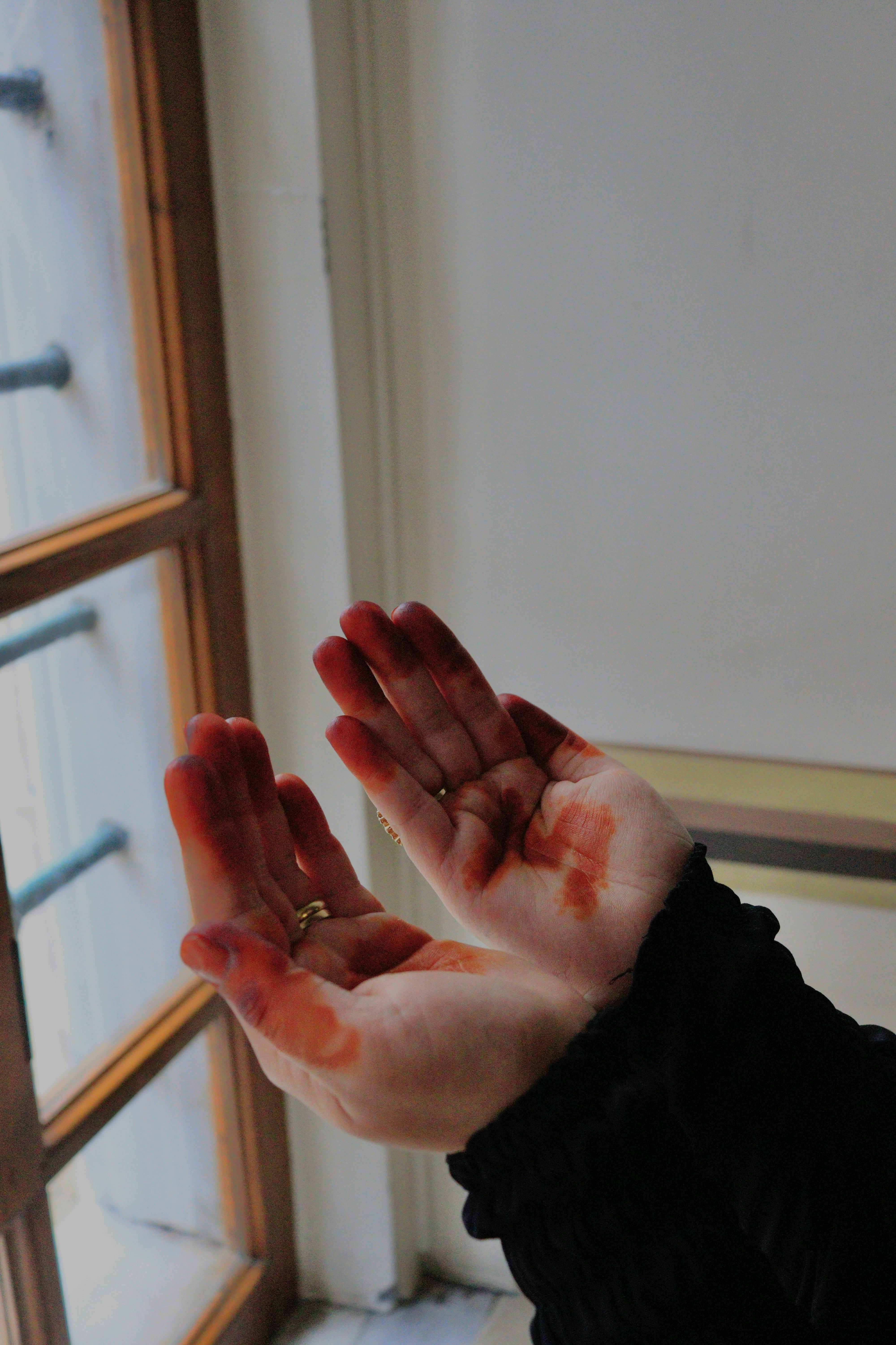 Closeup of Womans Red Painted Hands by a Window · Free Stock Photo
