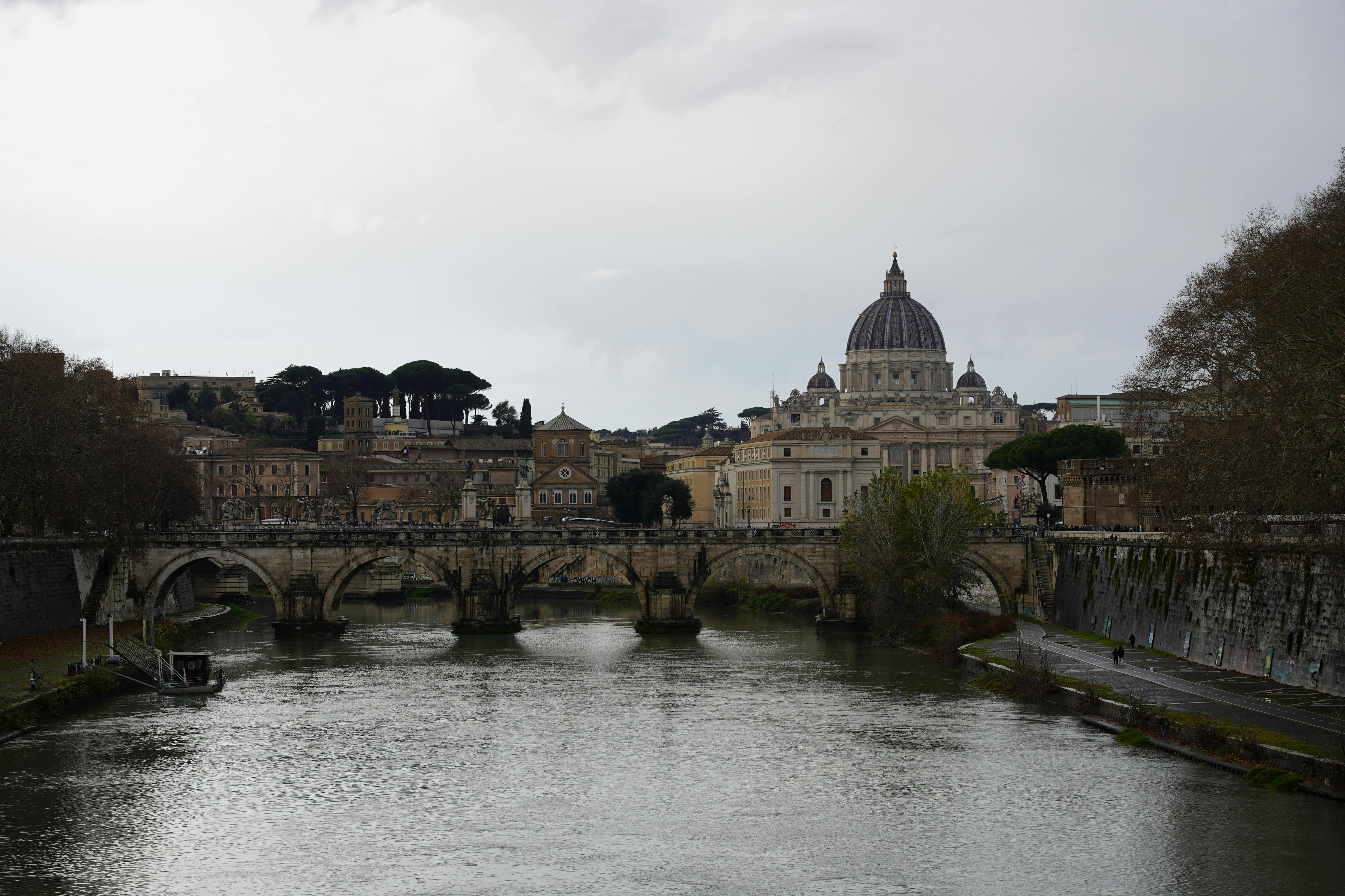 Tiber River with View of St Peter's Basilica in Rome, Italy Under Blue ...