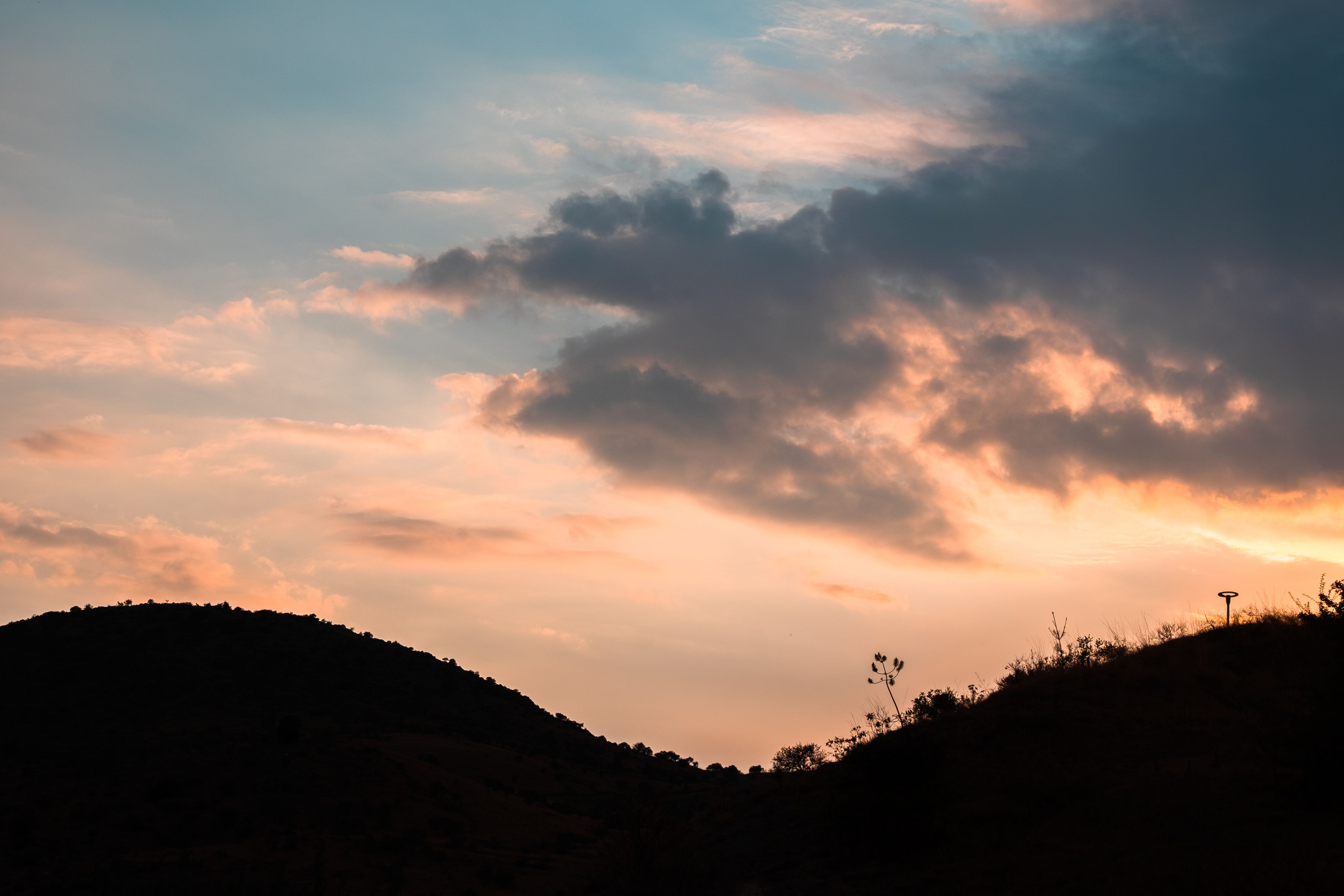 Outline of the Hills Against the Evening Sky · Free Stock Photo