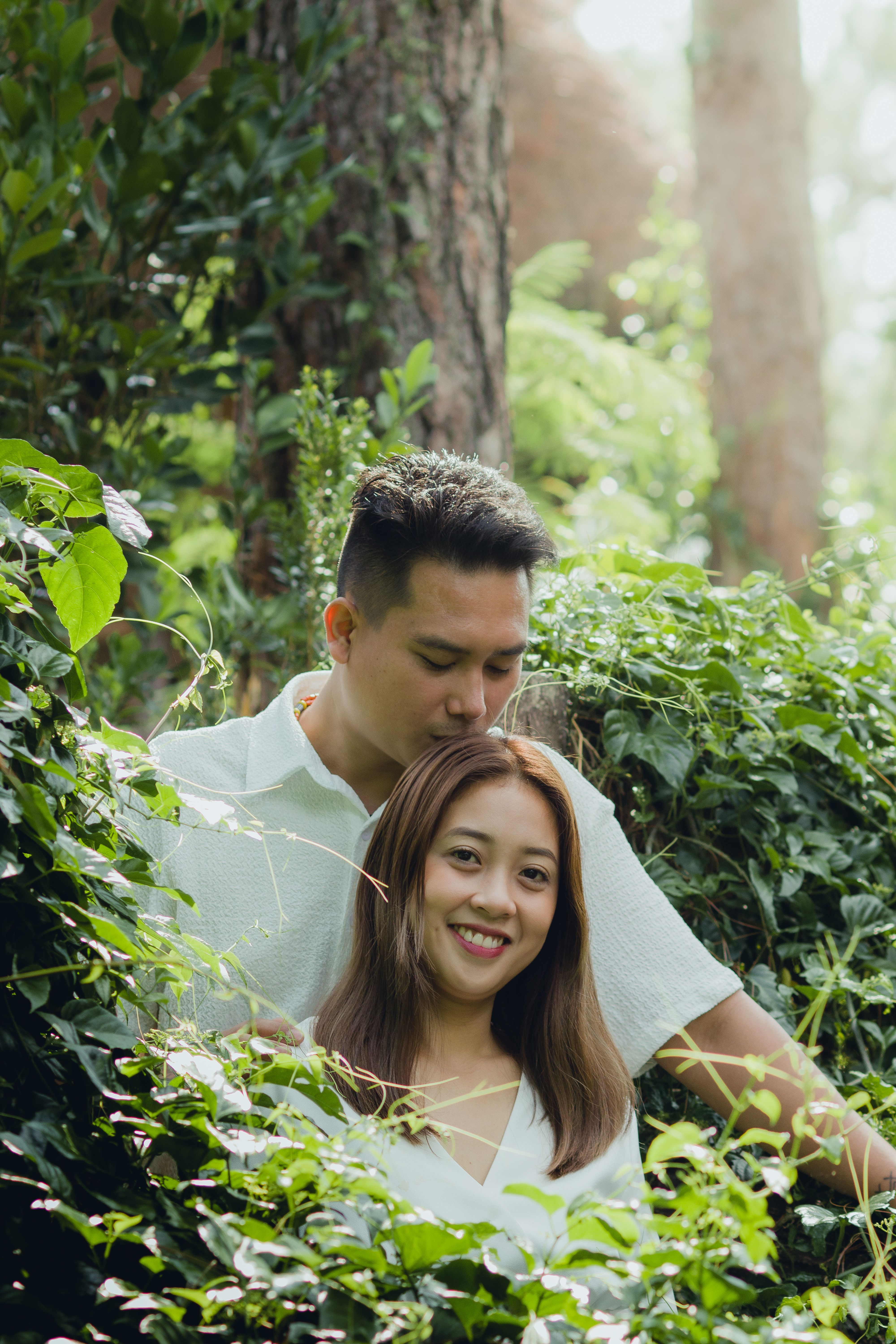 Young Couple Sitting in a Hammock in a Forest · Free Stock Photo