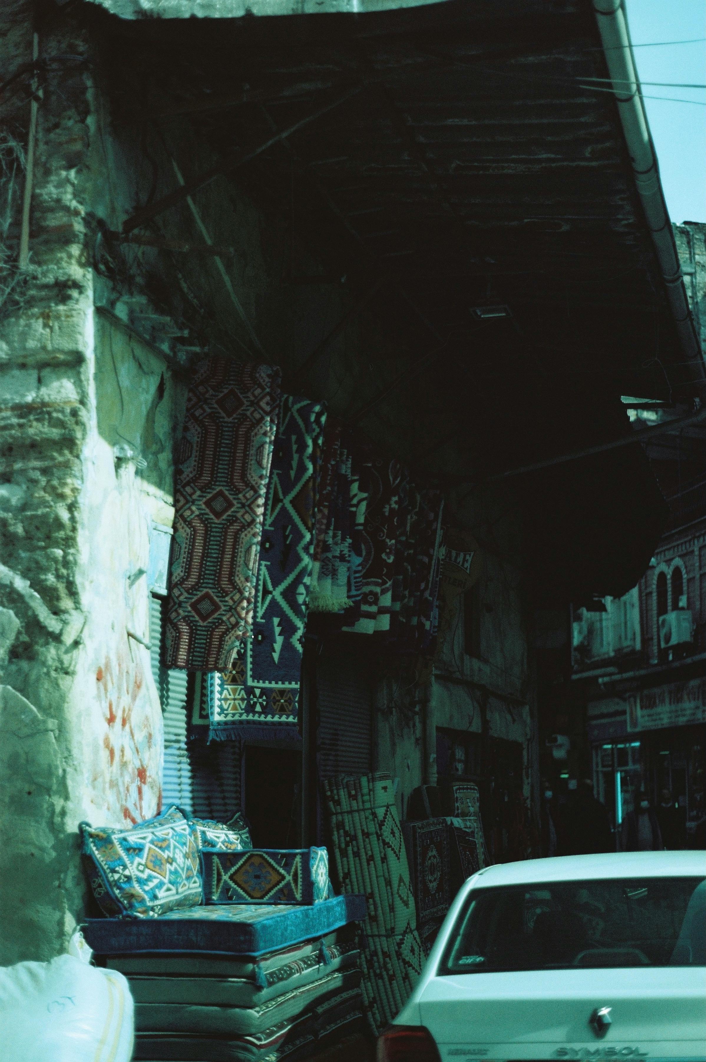 A white car parked in front of a building · Free Stock Photo